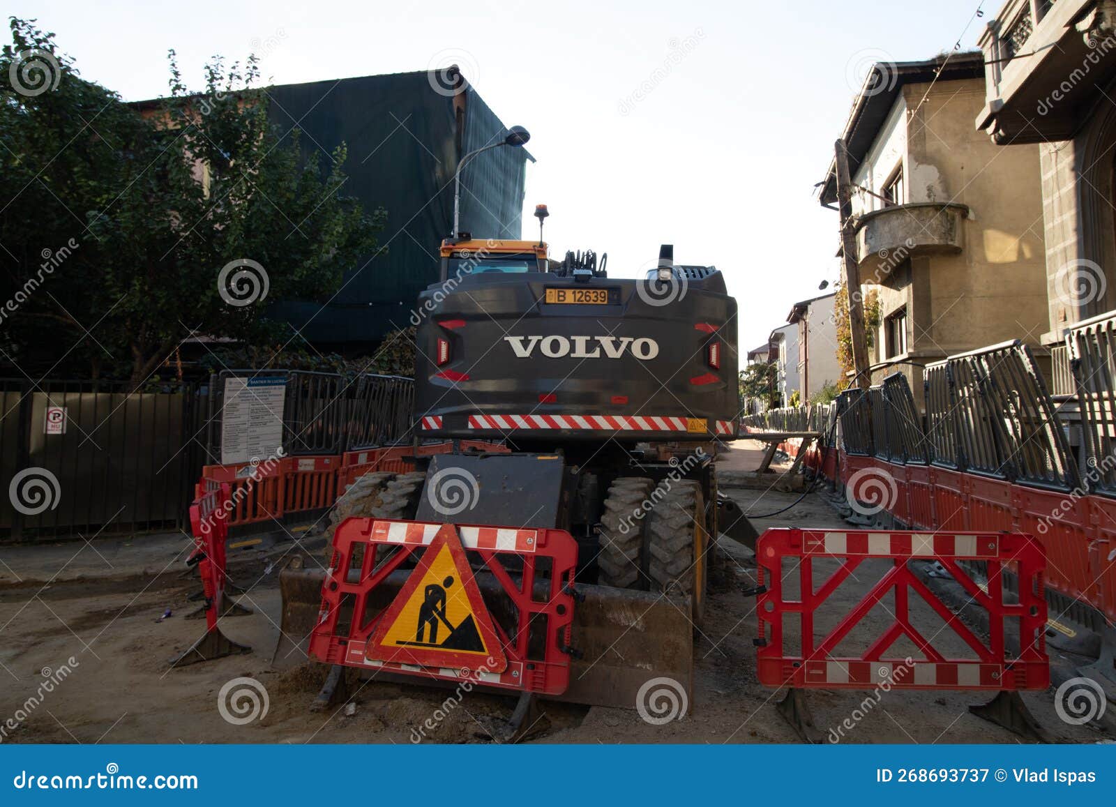 Construction Workers at Construction Site and Heavy Duty Bulldozer in ...