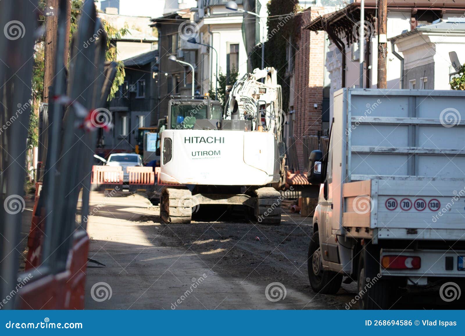Construction Workers at Construction Site and Heavy Duty Bulldozer in ...