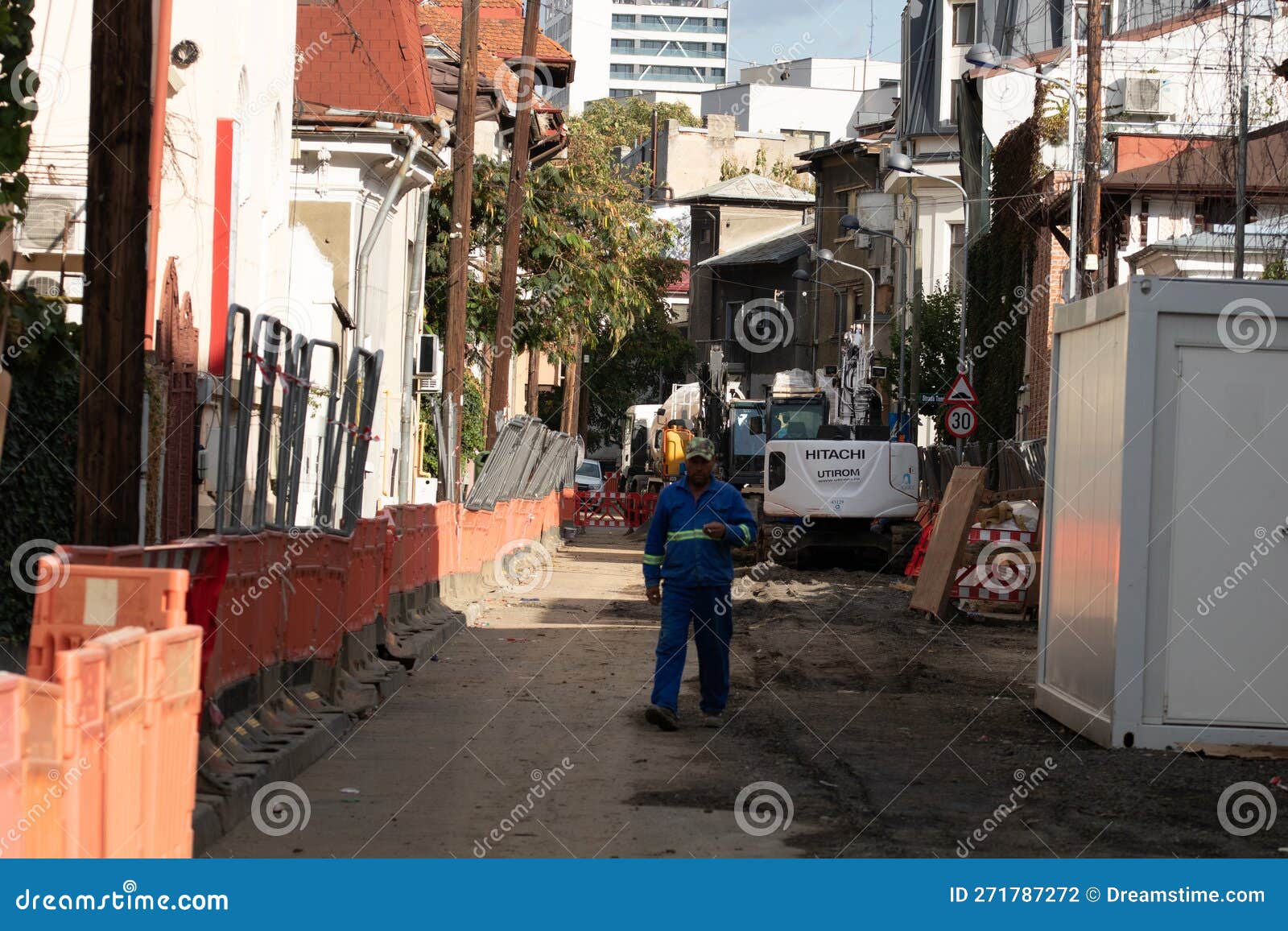 Construction Workers at Construction Site and Heavy Duty Bulldozer in ...