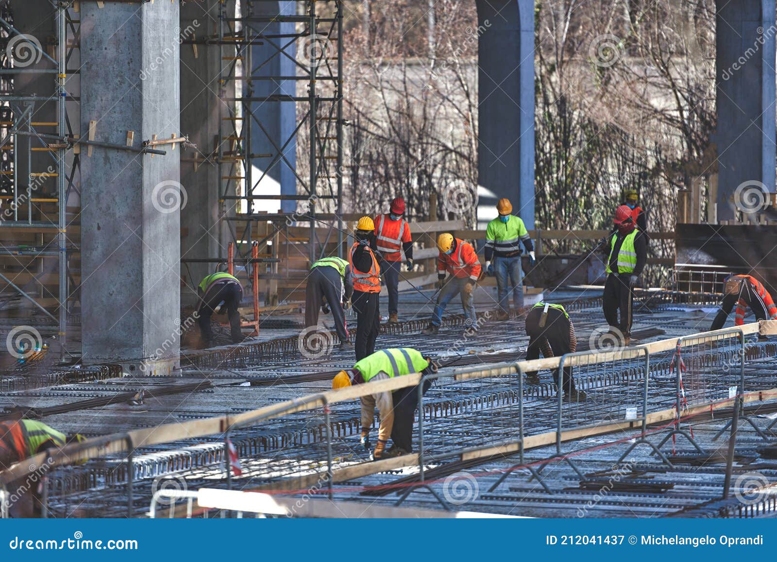 Construction Workers on Site with Protective Masks for Covid 19 ...