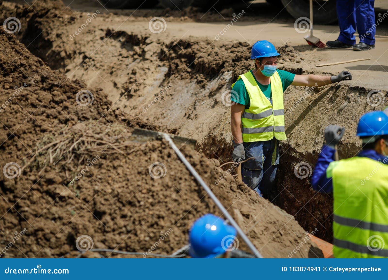 Construction Workers on a Construction Site with Protective Masks Due ...