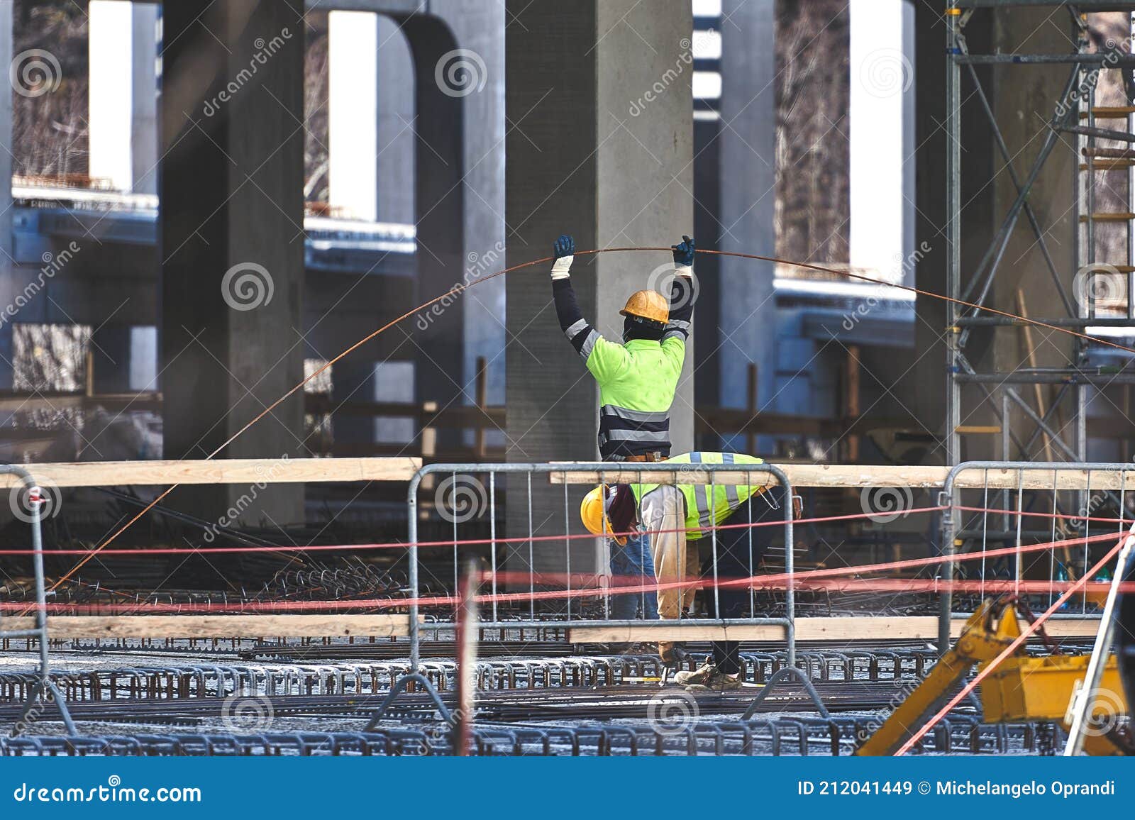 Construction Workers on the Construction Site Work with Concrete ...