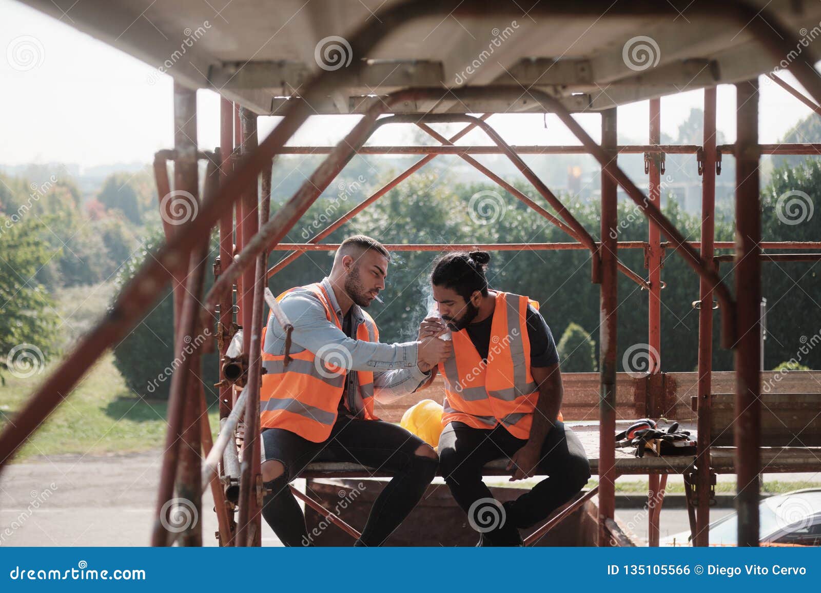 Construction Workers Smoking Cigarette and Talking on Break Stock Photo ...