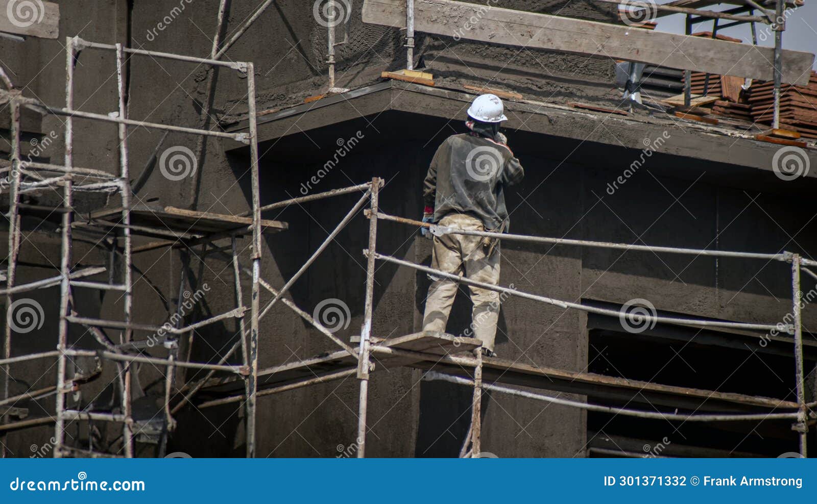 Construction Workers Spraying Stucco on the Exterior of a Building ...