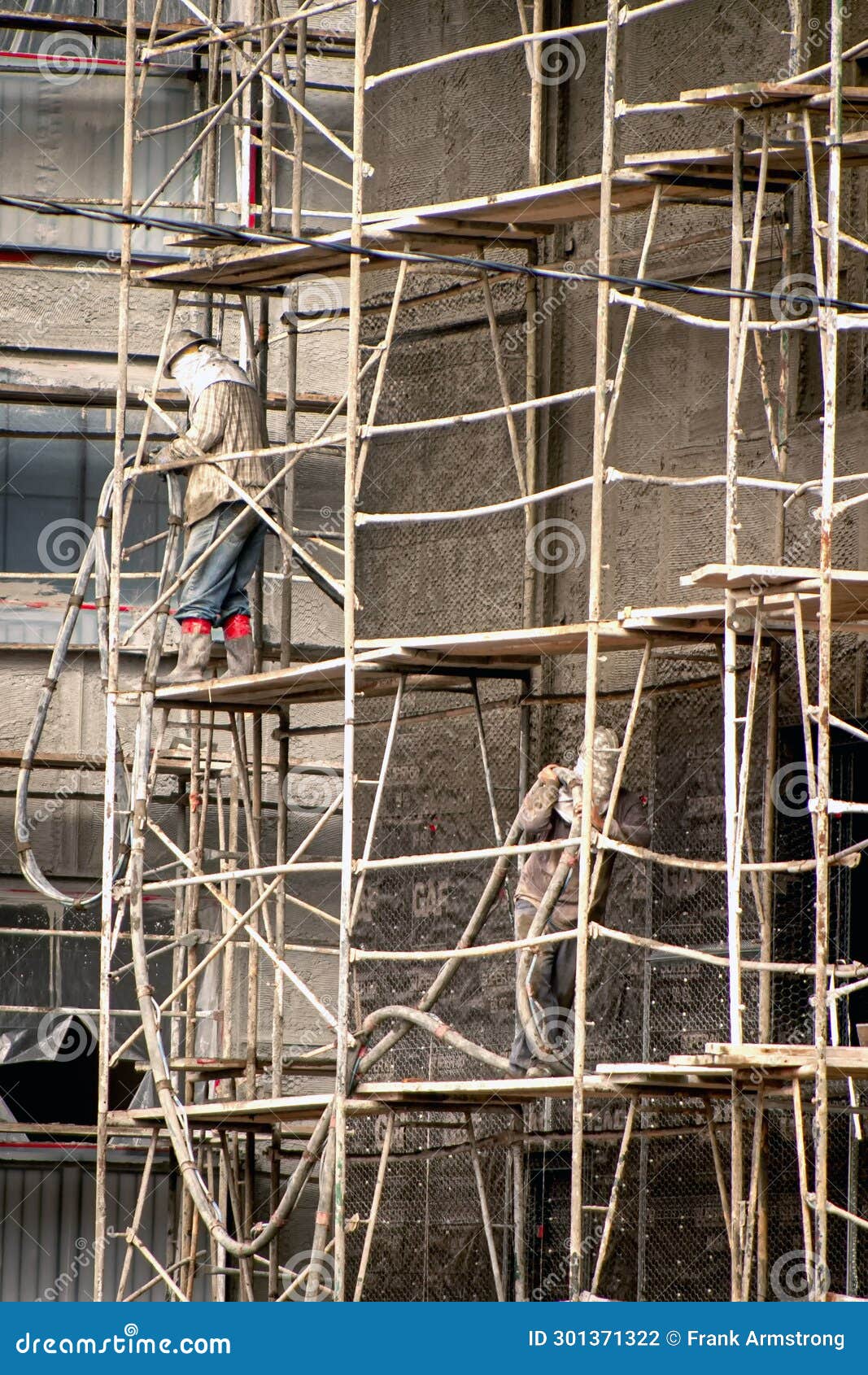 Construction Workers Spraying Stucco on the Exterior of a Building ...