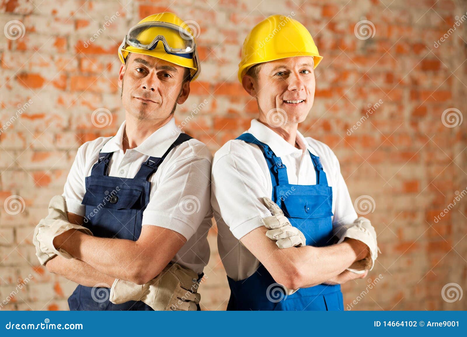 Construction Workers Standing with Folded Arms Stock Photo - Image of ...