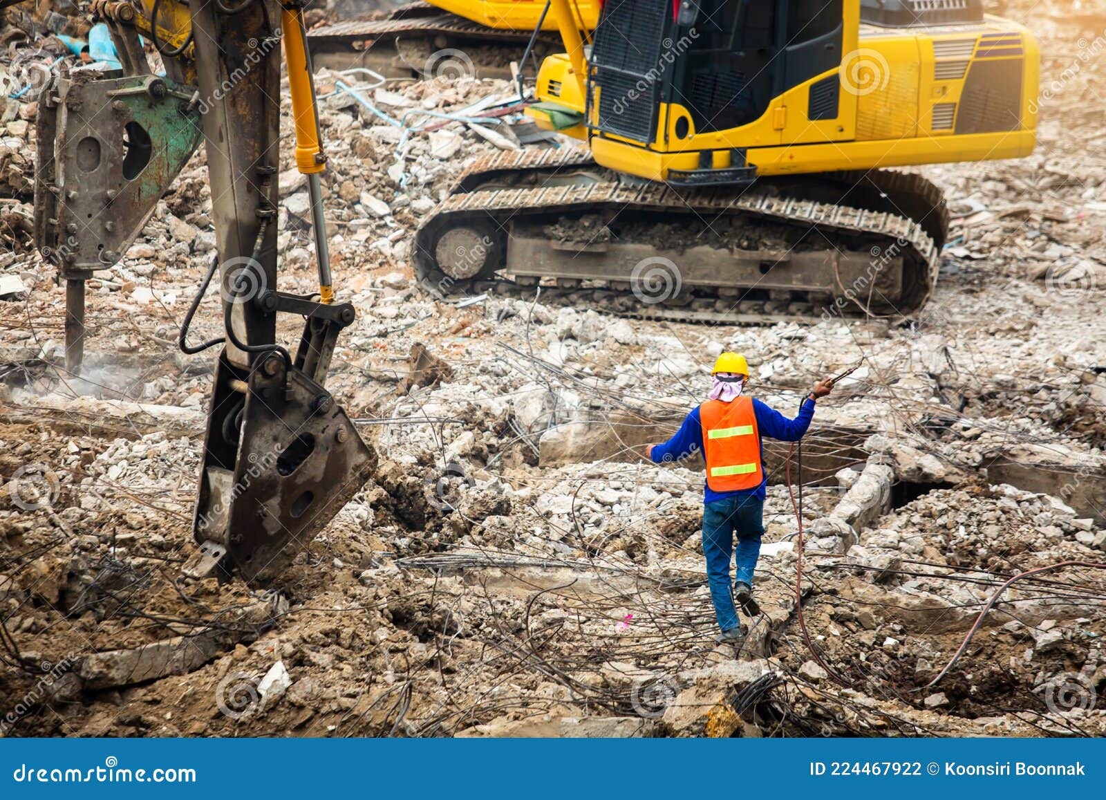 Construction Workers Standing among the Rubble of Demolished Buildings ...