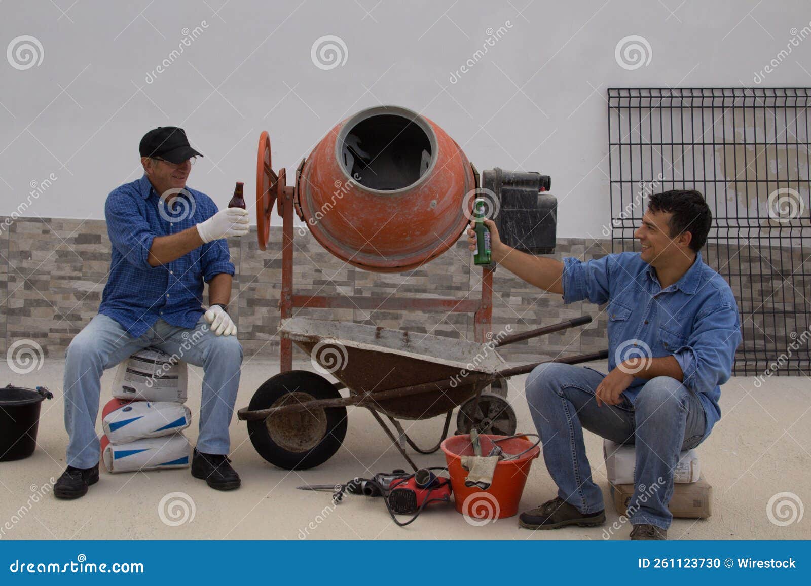 Construction Workers Taking a Break while Drinking a Beer. Men at Work ...