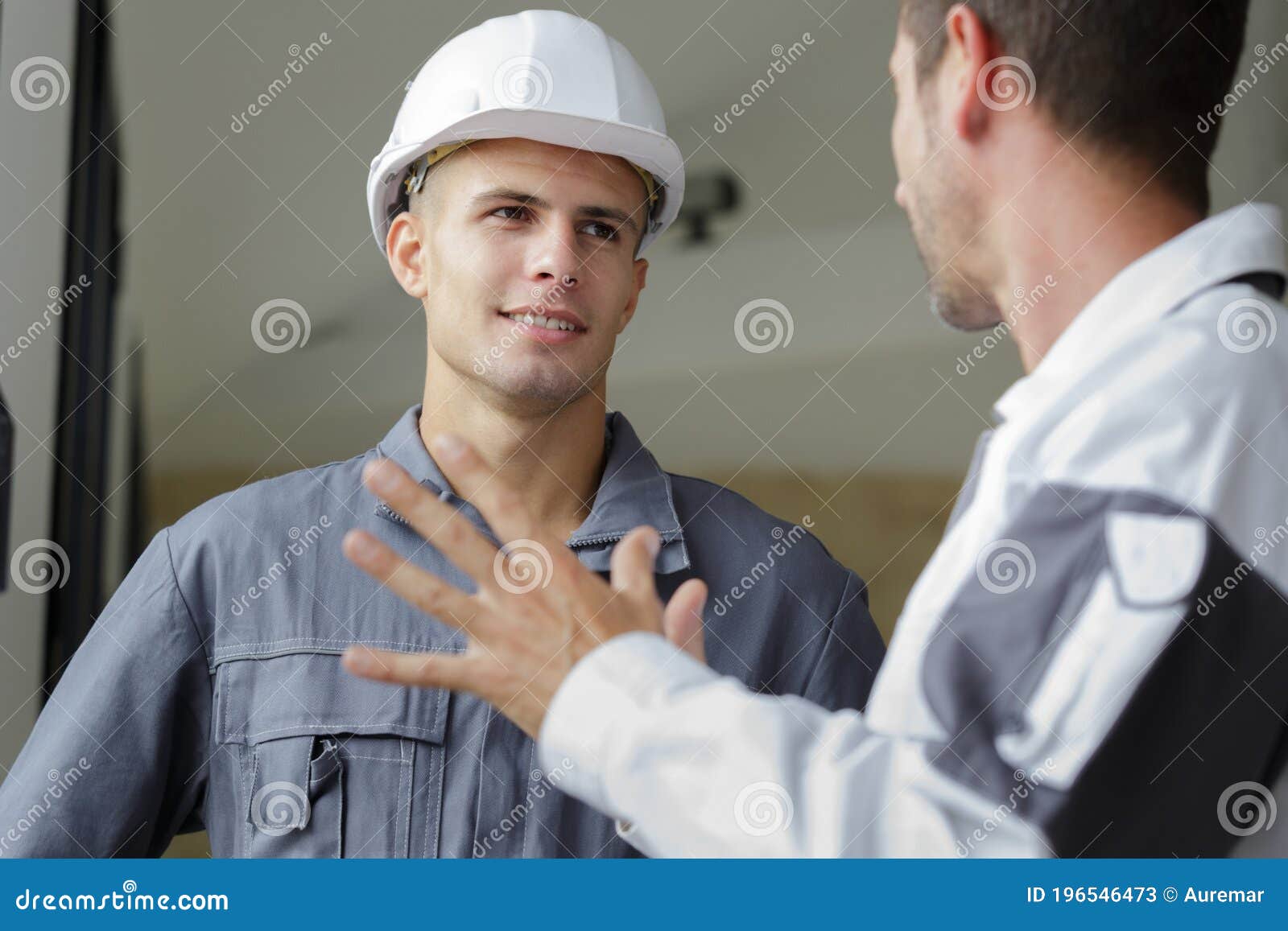 2 Construction Workers Talking Stock Image - Image of operate, trainee ...