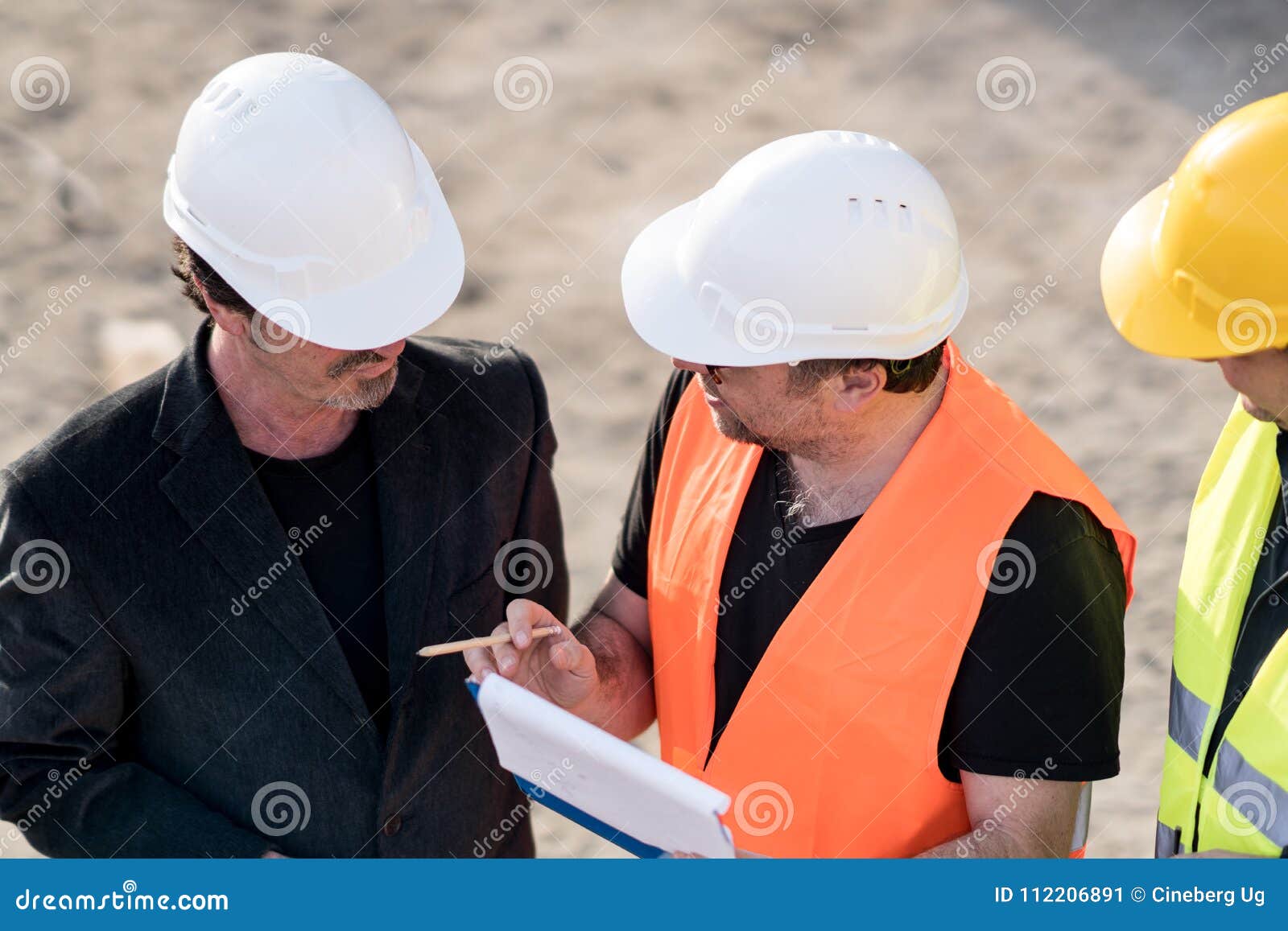 Construction Workers Talking on Construction Site Stock Image - Image ...