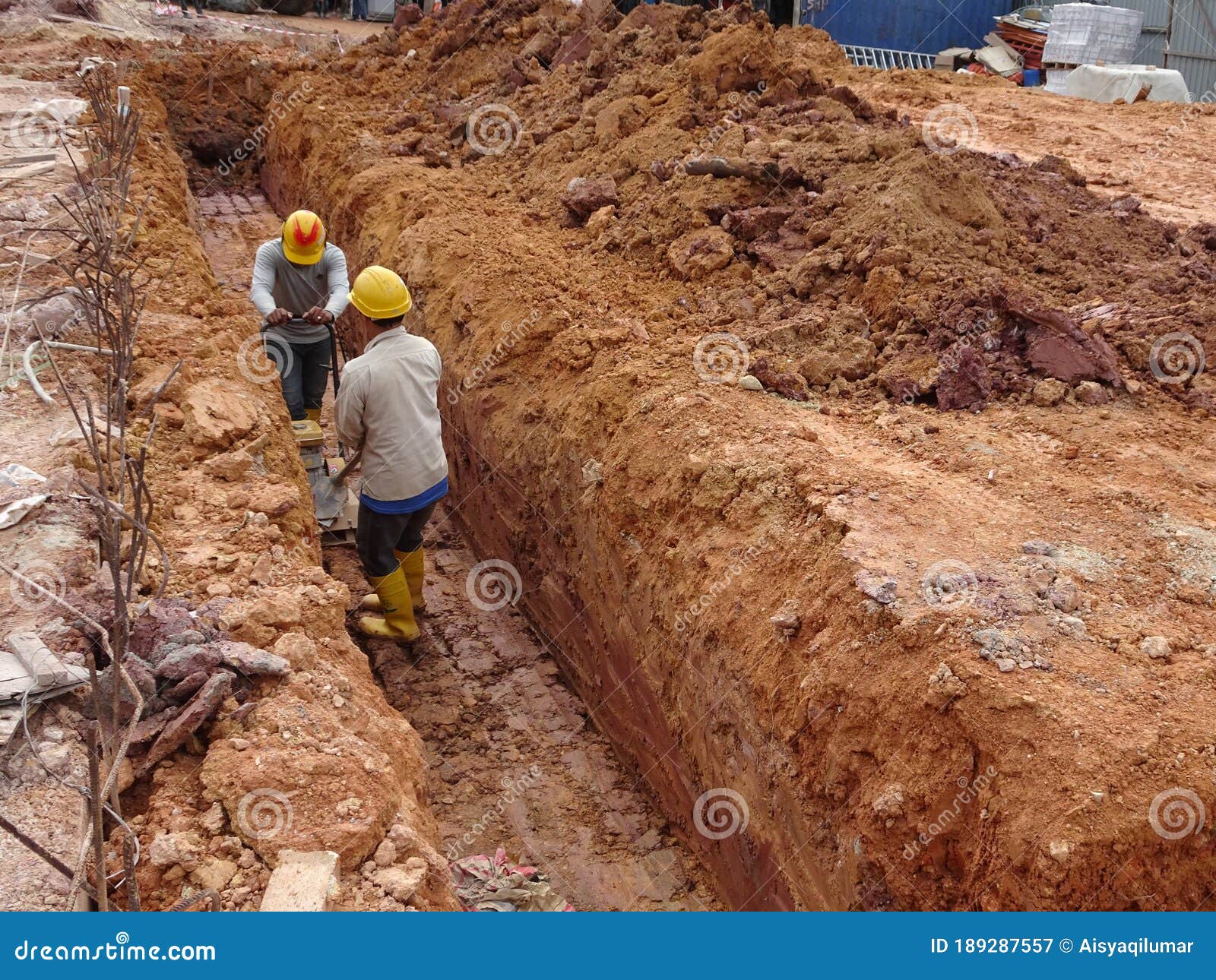 Construction Workers are Using the Baby Compactor To Level and Compact ...