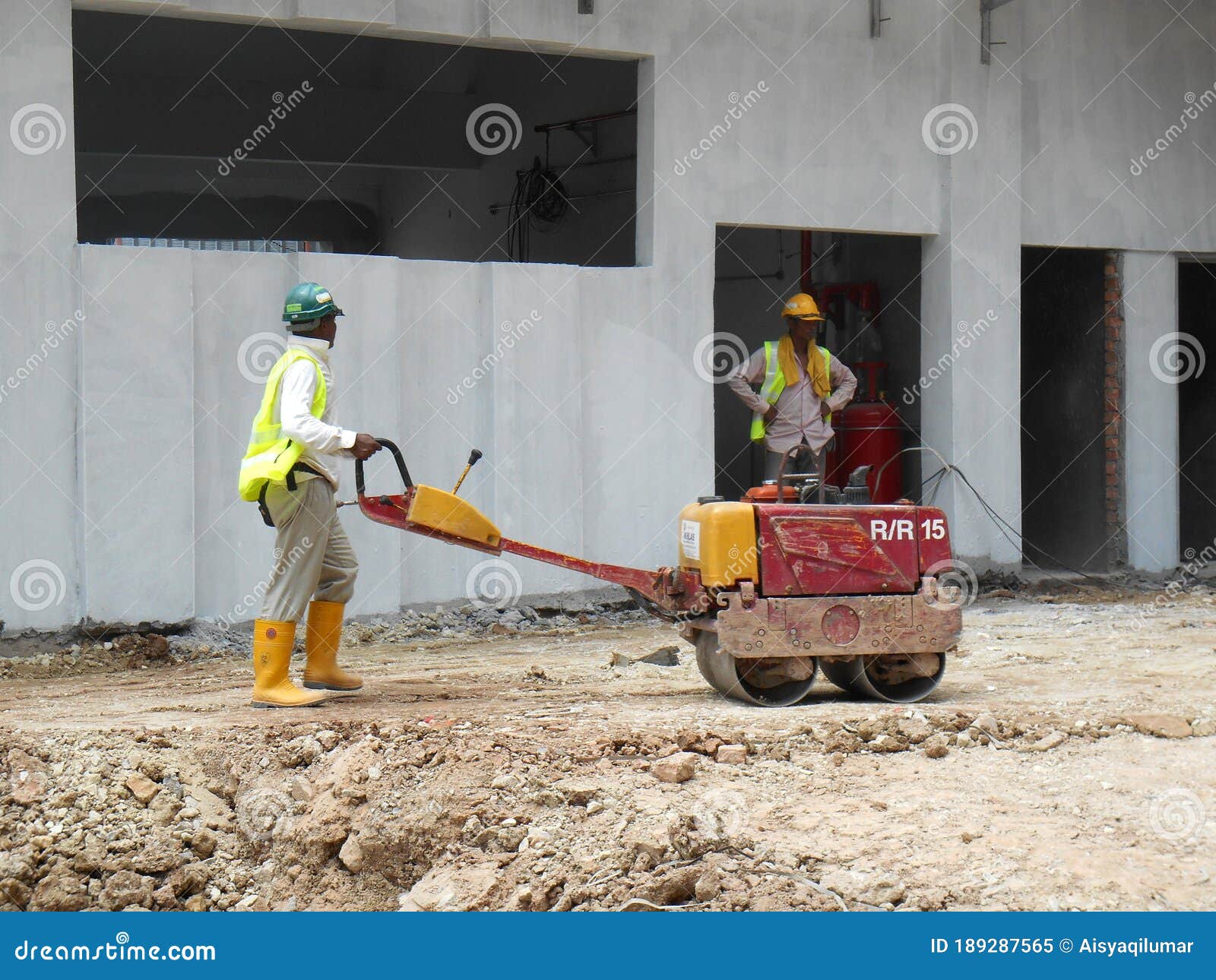 Construction Workers are Using the Baby Compactor To Level and Compact ...