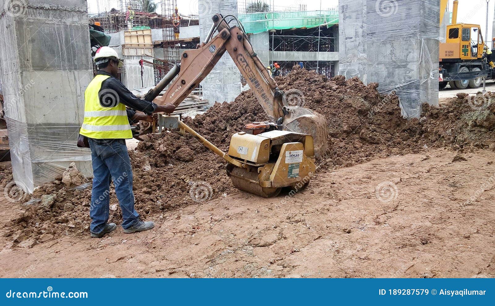 Construction Workers are Using the Baby Compactor To Level and Compact ...