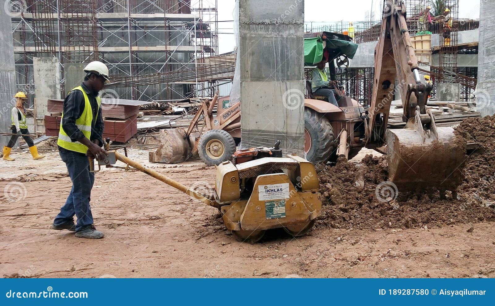 Construction Workers are Using the Baby Compactor To Level and Compact ...