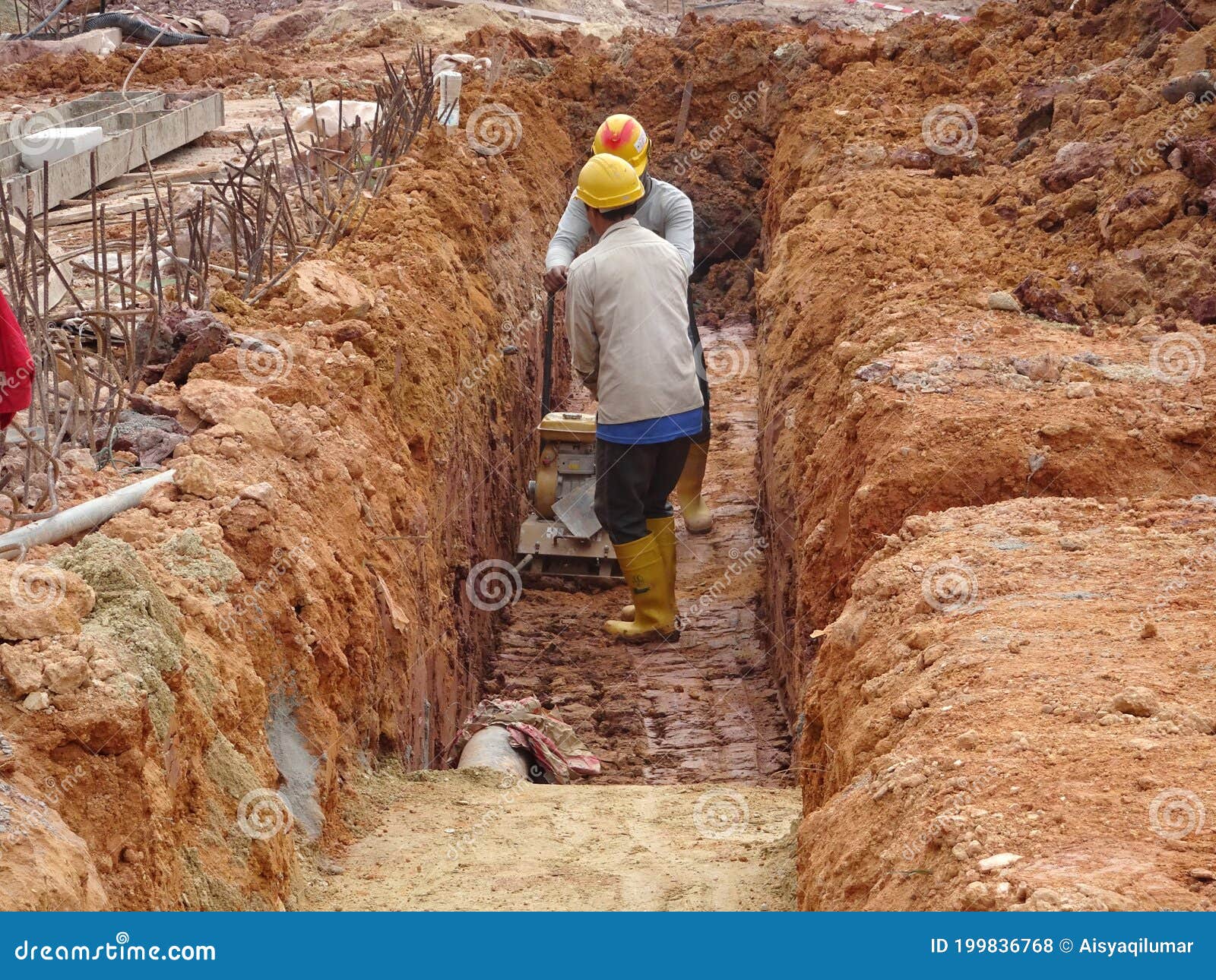 Construction Workers are Using the Baby Compactor To Level and Compact ...