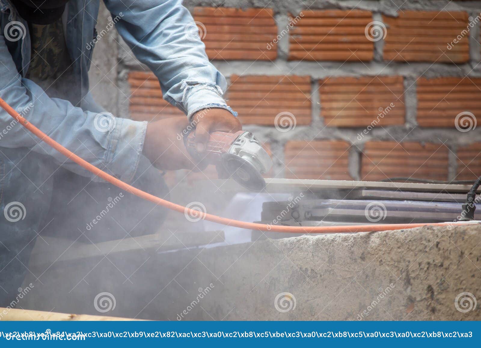 Construction Workers are Using Cutting Machines To Cut through the ...
