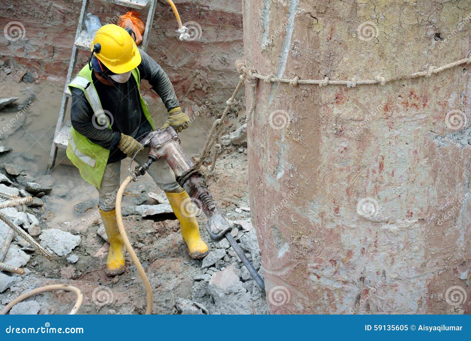 Construction Workers Using Mobile Concrete Hacker at the Construction ...
