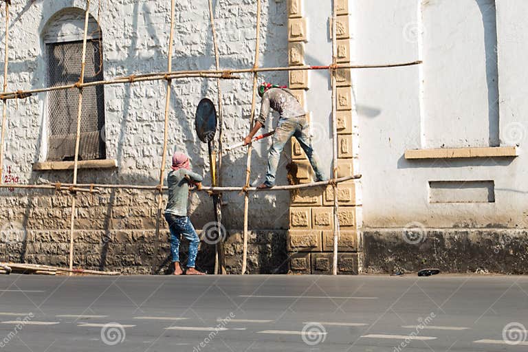 Construction Workers with Very Poor Security Working on a Building in ...