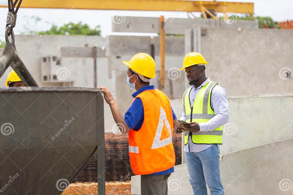 Construction Workers at Work, Foreman and Worker Team Discussing at ...