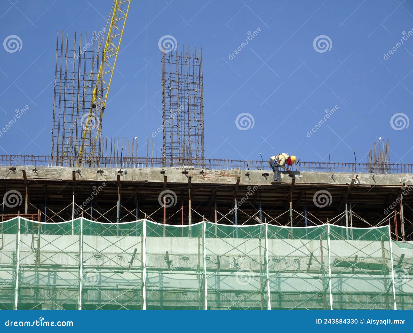 Construction Workers Working at Height at the Construction Site ...