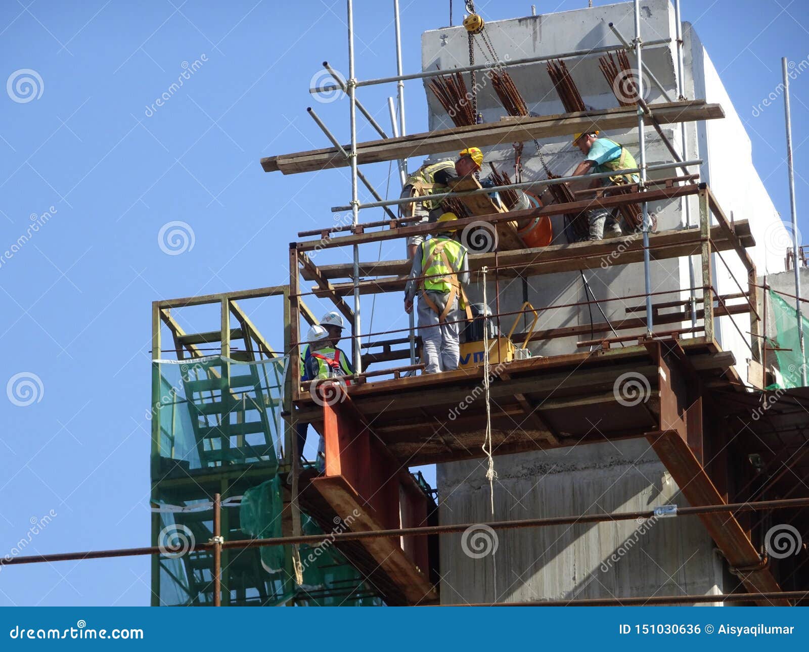 Construction Workers Working at Height at the Construction Site ...