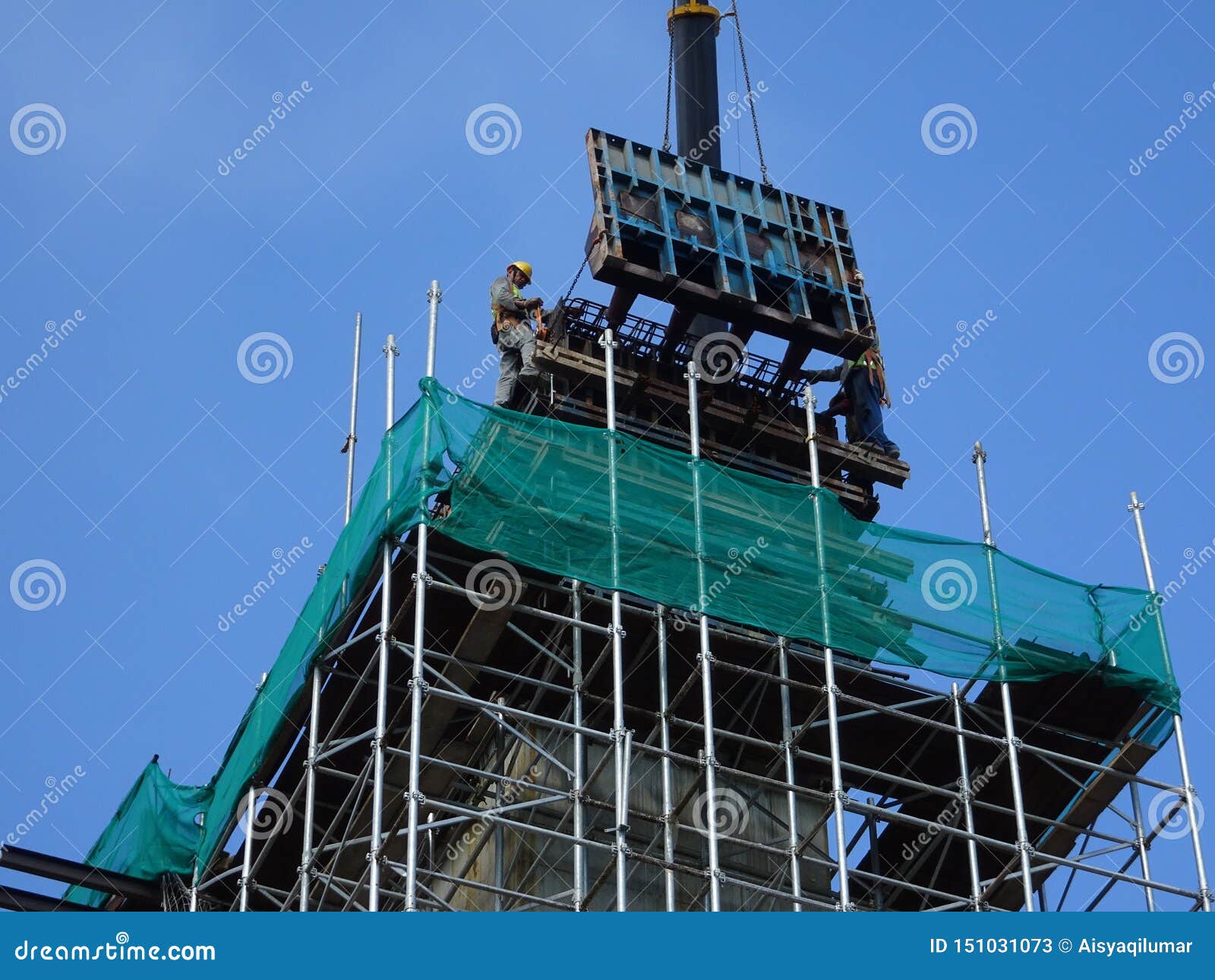 Construction Workers Working at Height at the Construction Site ...