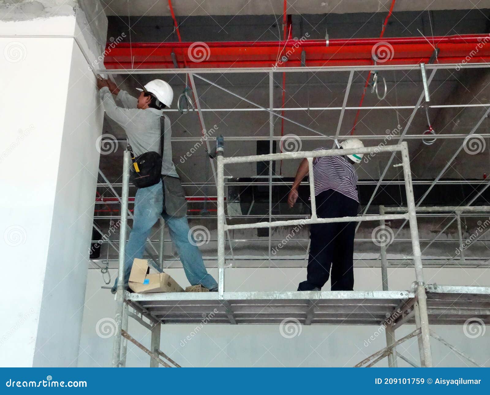 Construction Workers Working at Height at the Construction Site ...