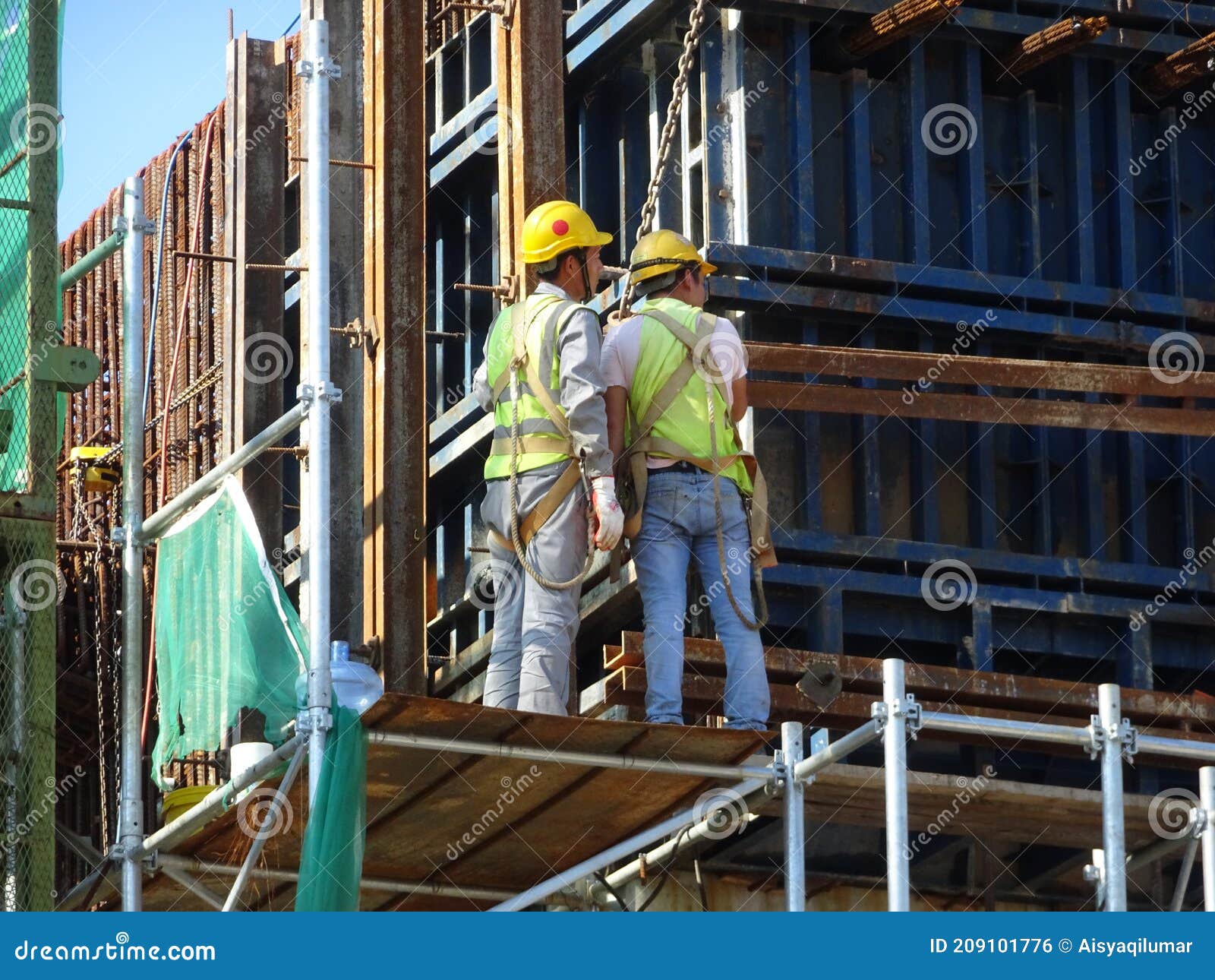 Construction Workers Working at Height at the Construction Site ...