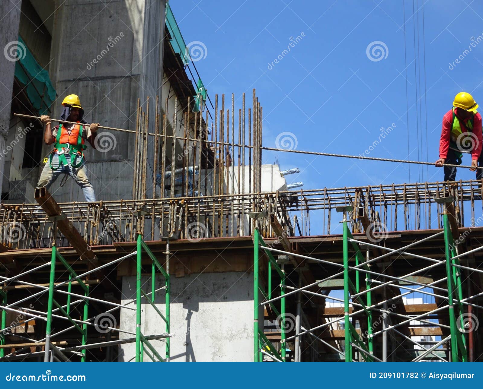 Construction Workers Working at Height at the Construction Site ...
