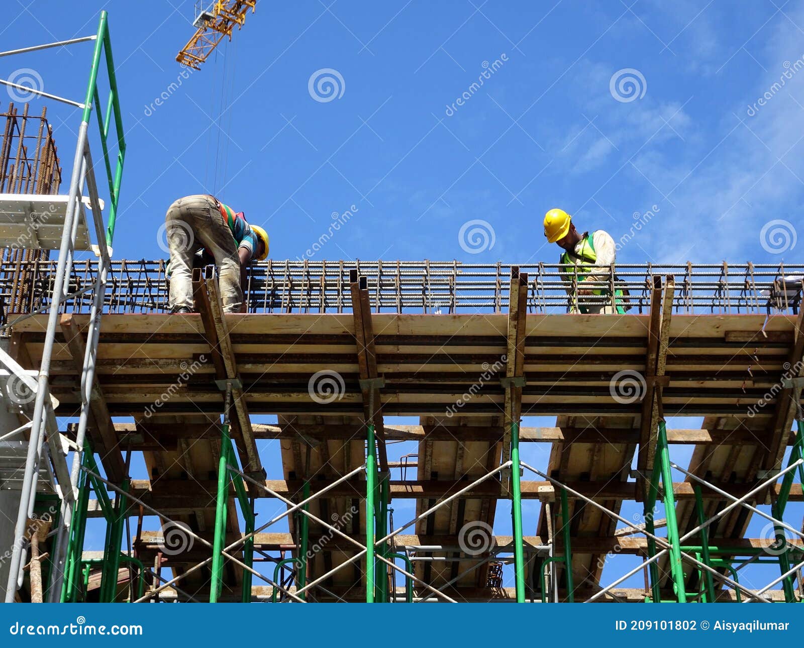 Construction Workers Working at Height at the Construction Site ...