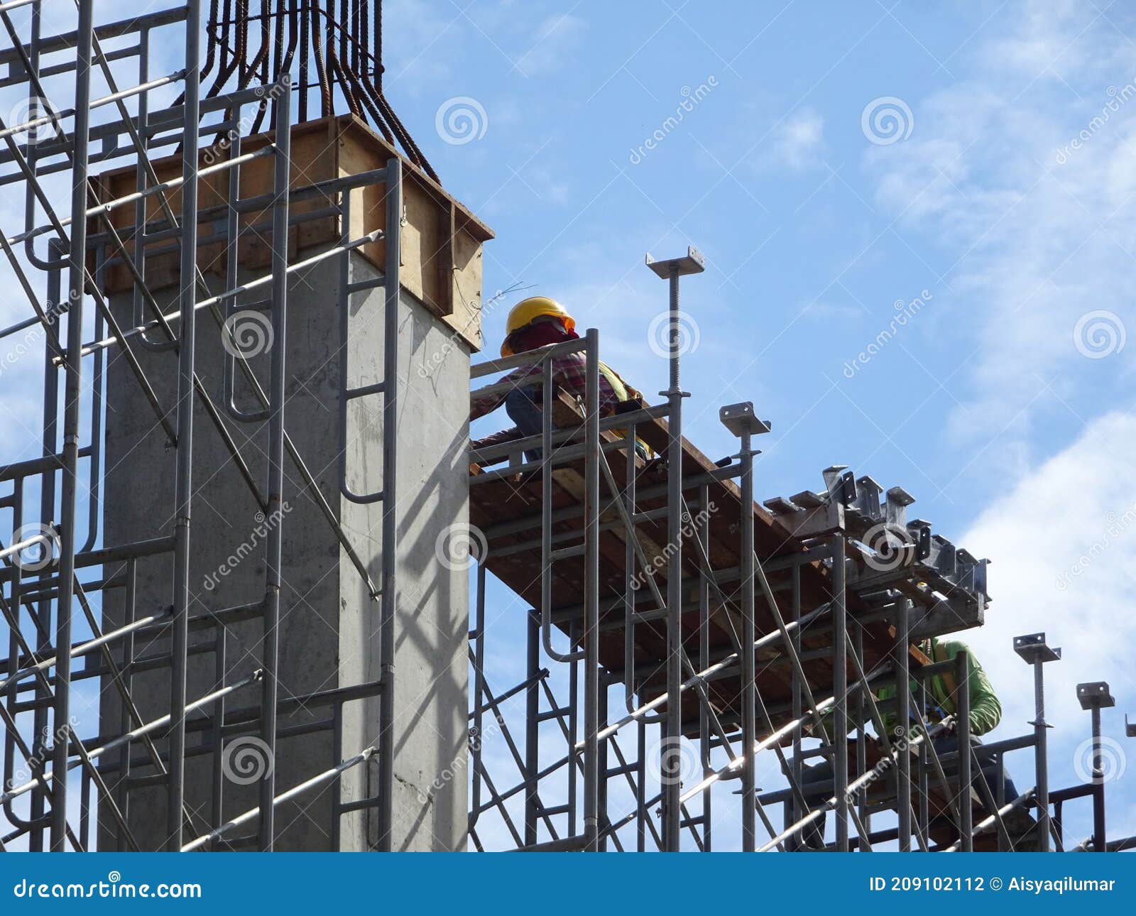 Construction Workers Working at Height at the Construction Site ...