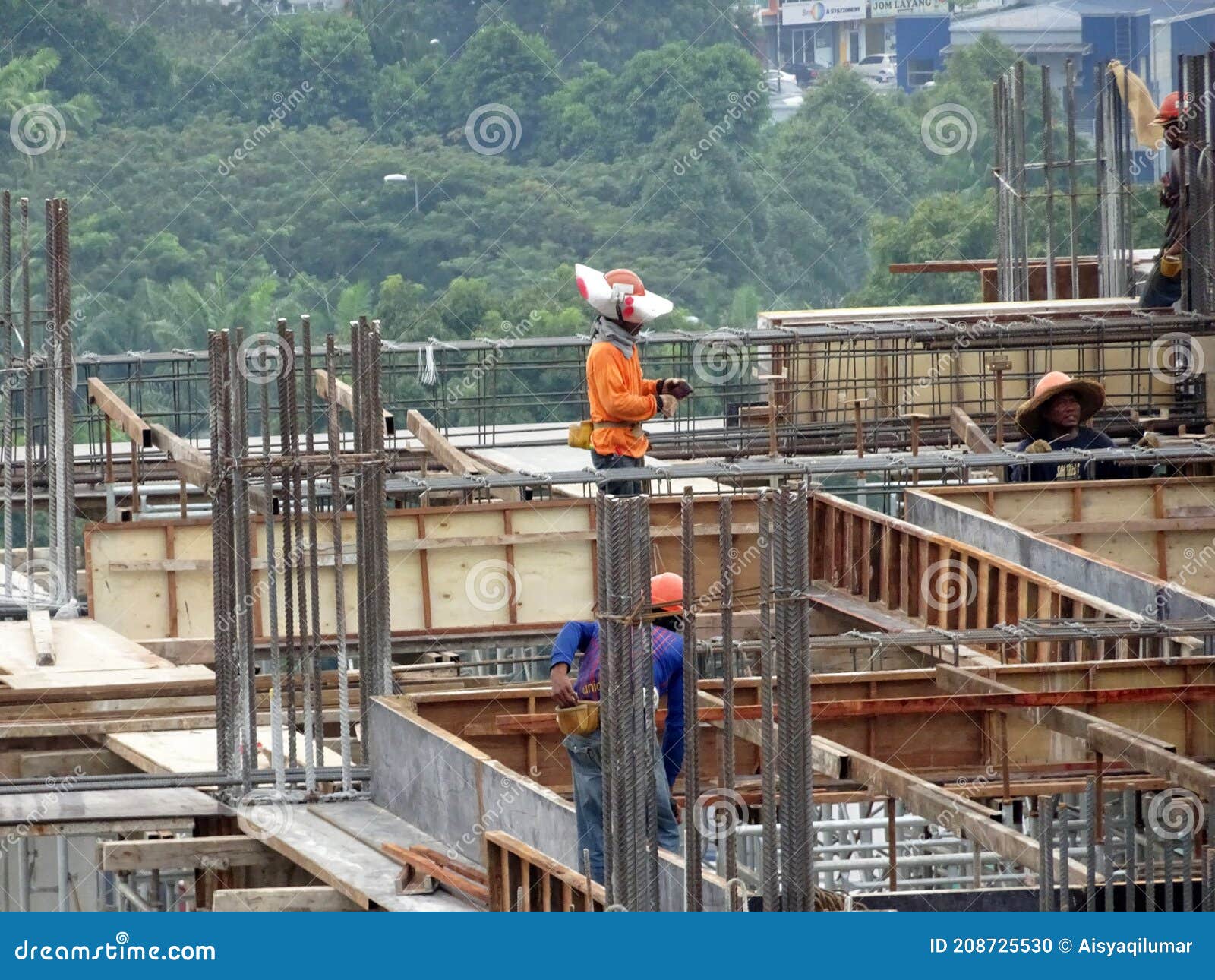 Construction Workers Working at Height Install Reinforcement Bars at ...