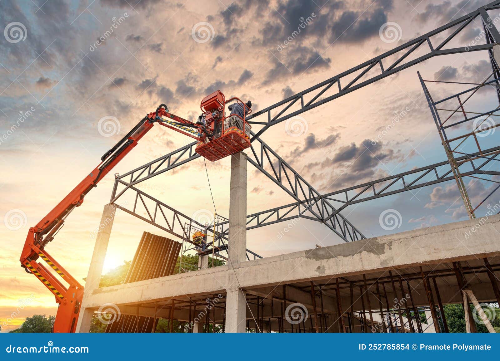 Construction Workers Working on Construction Machine. Aerial Platform ...