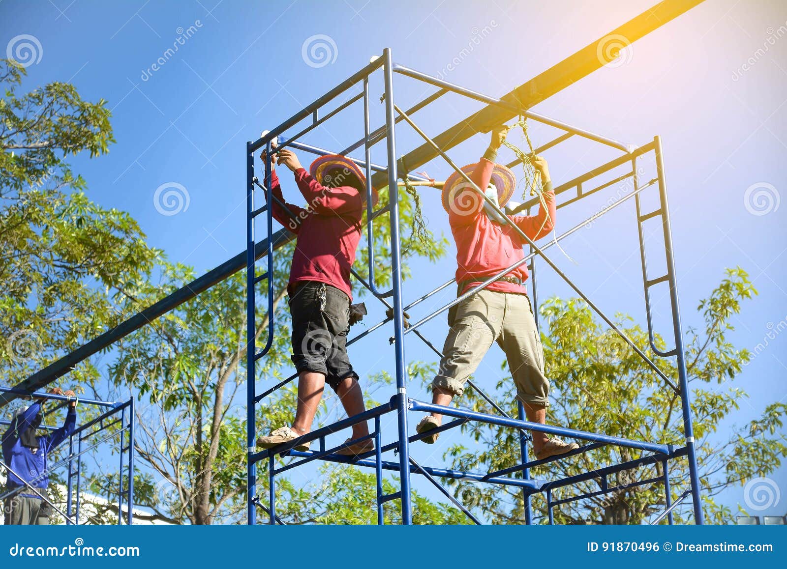 Construction Workers Working on Scaffolding. Stock Photo - Image of ...