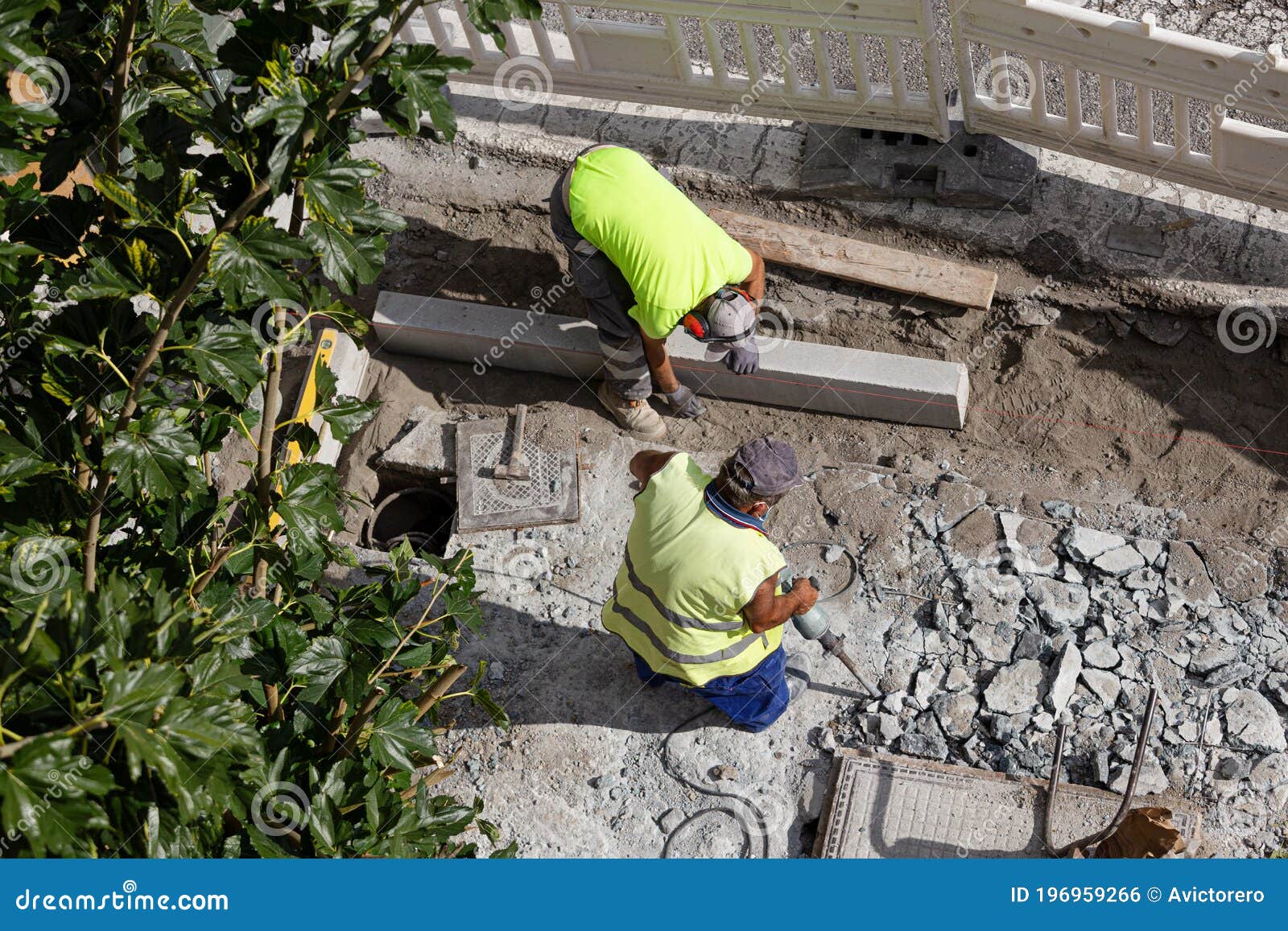 Construction Workers Working on Sidewalk Stock Photo - Image of ...