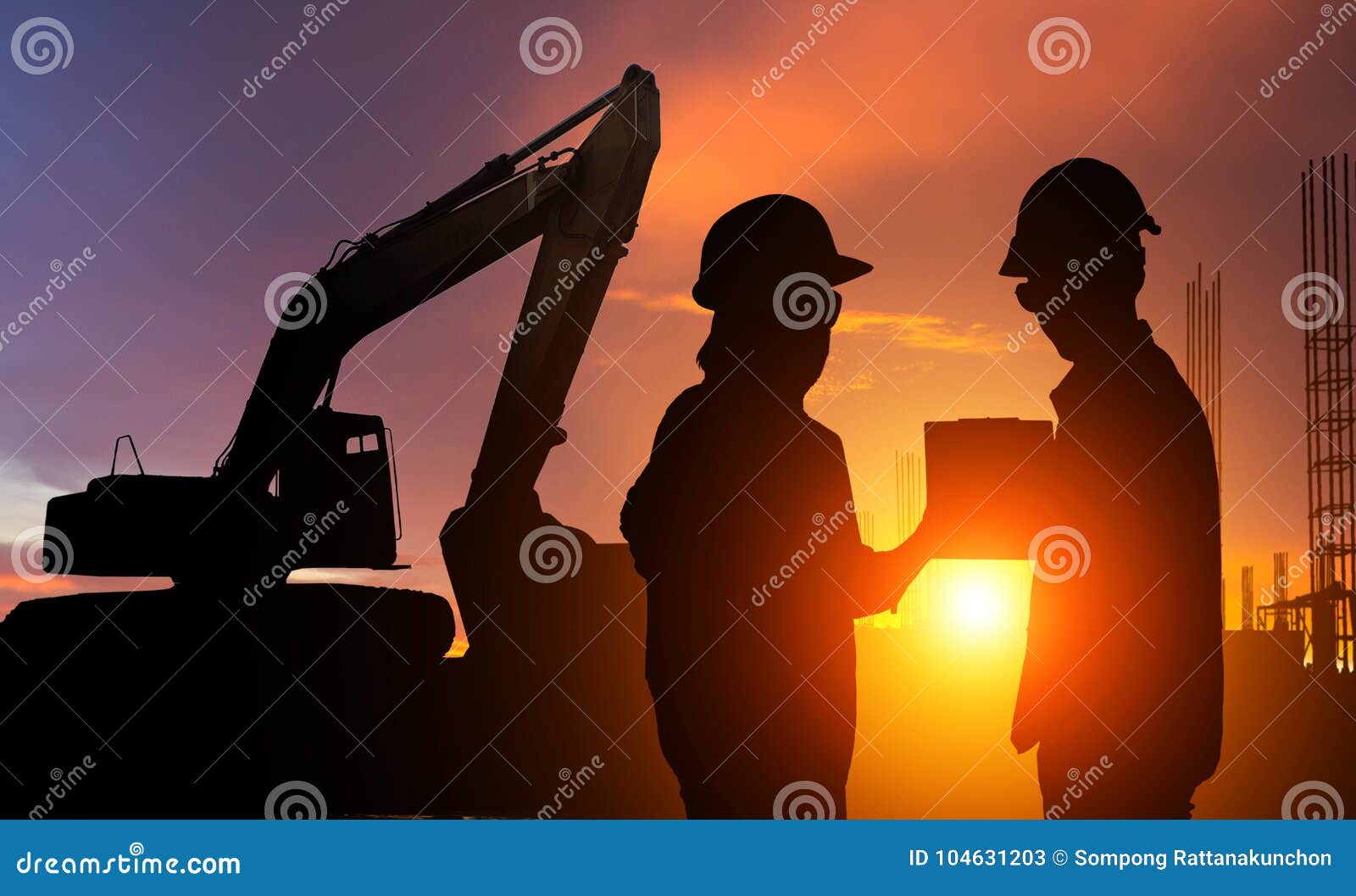 Construction Workers Working On A Construction Site At Sunset For ...