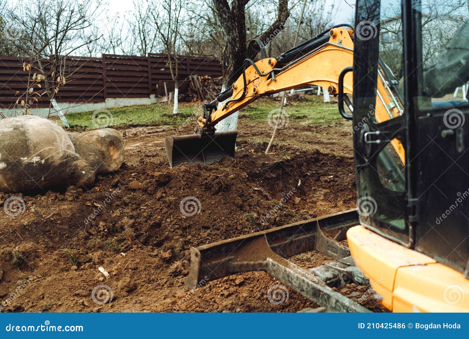 Construction Works with Excavator Doing Some Digging and Earth Moving ...