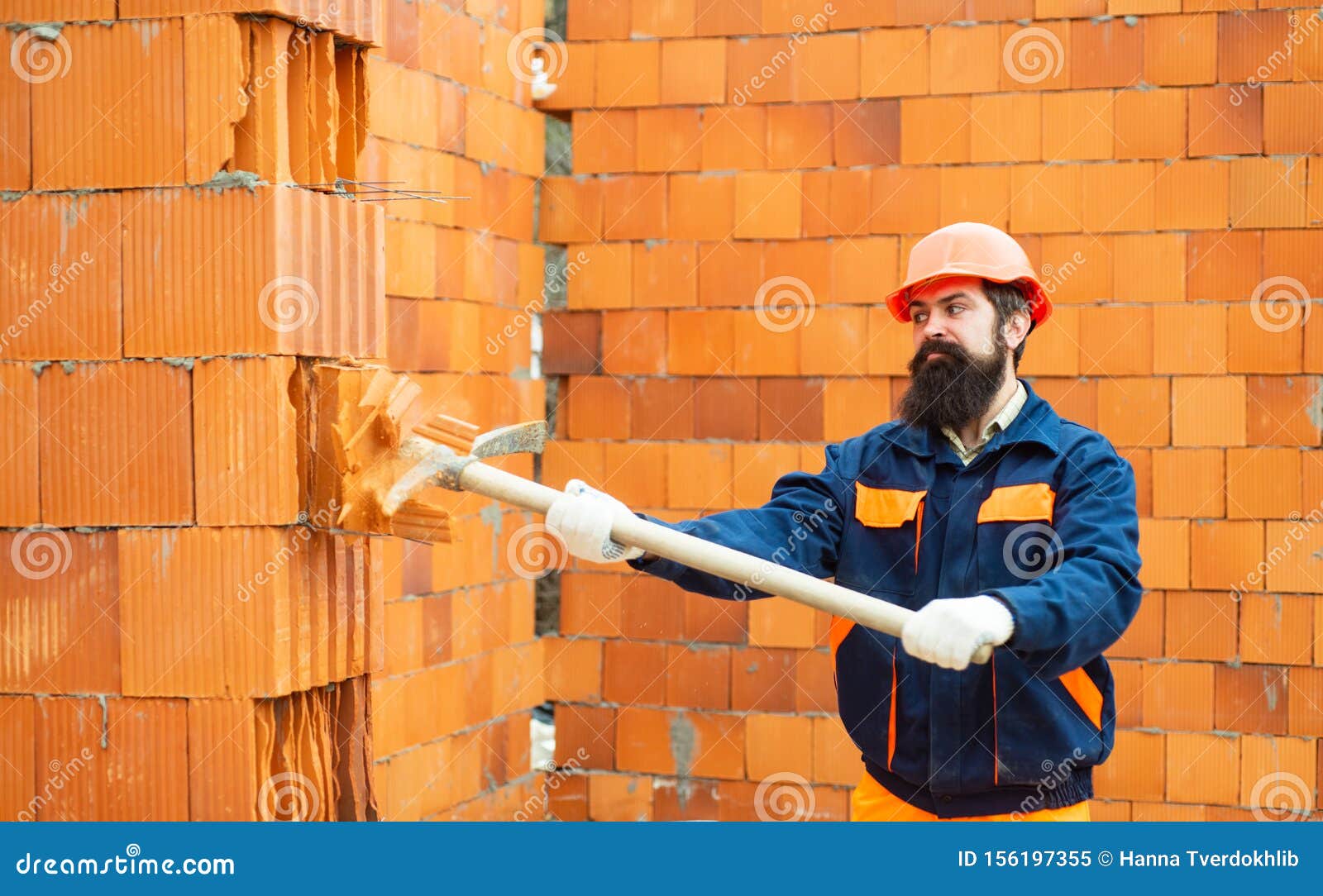 Constructor Profession and Buildings. Builder Shows a Brick Wall Stock ...