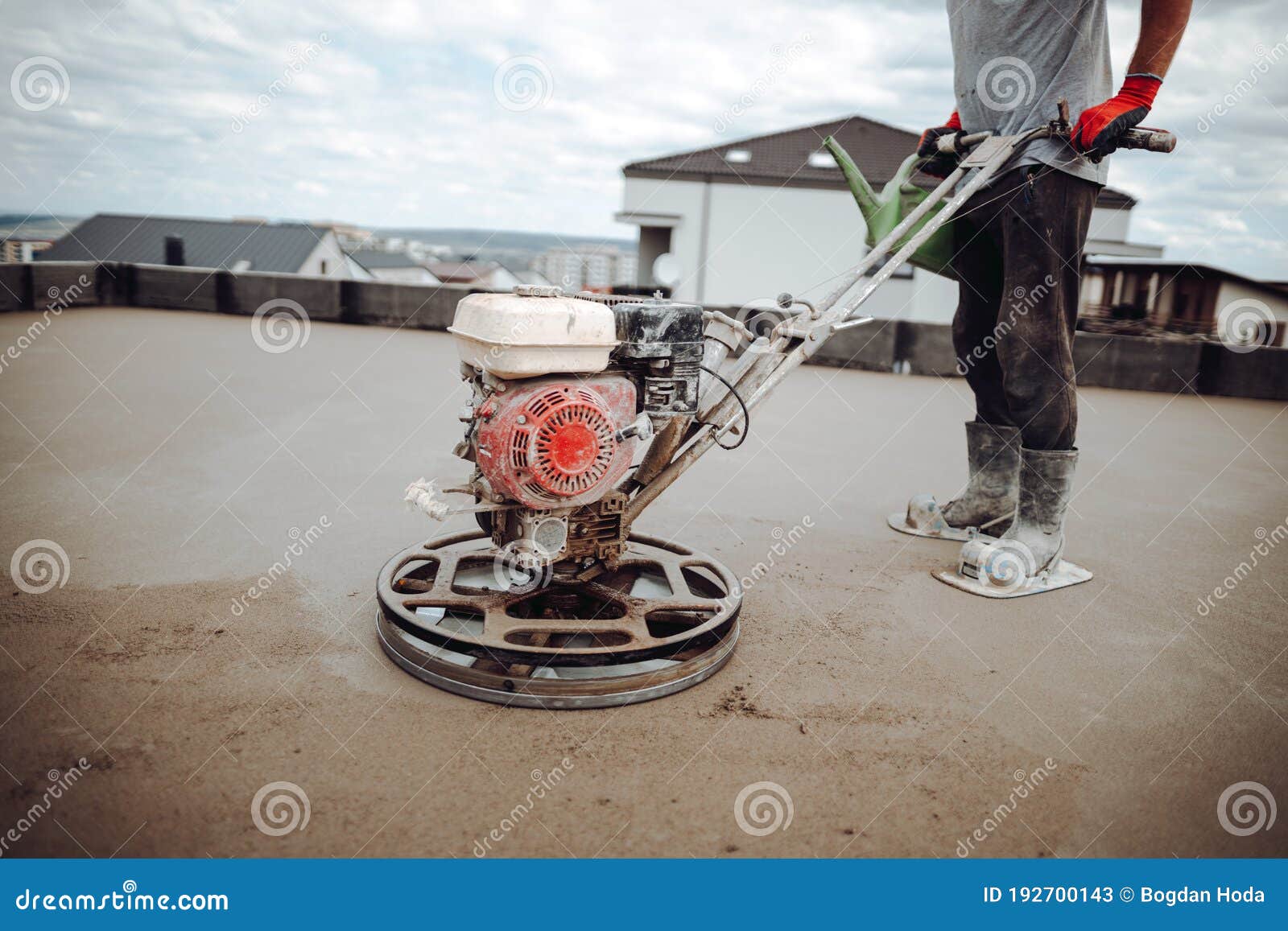 Constrution Worker Installing and Polishing Sand and Cement Screed ...