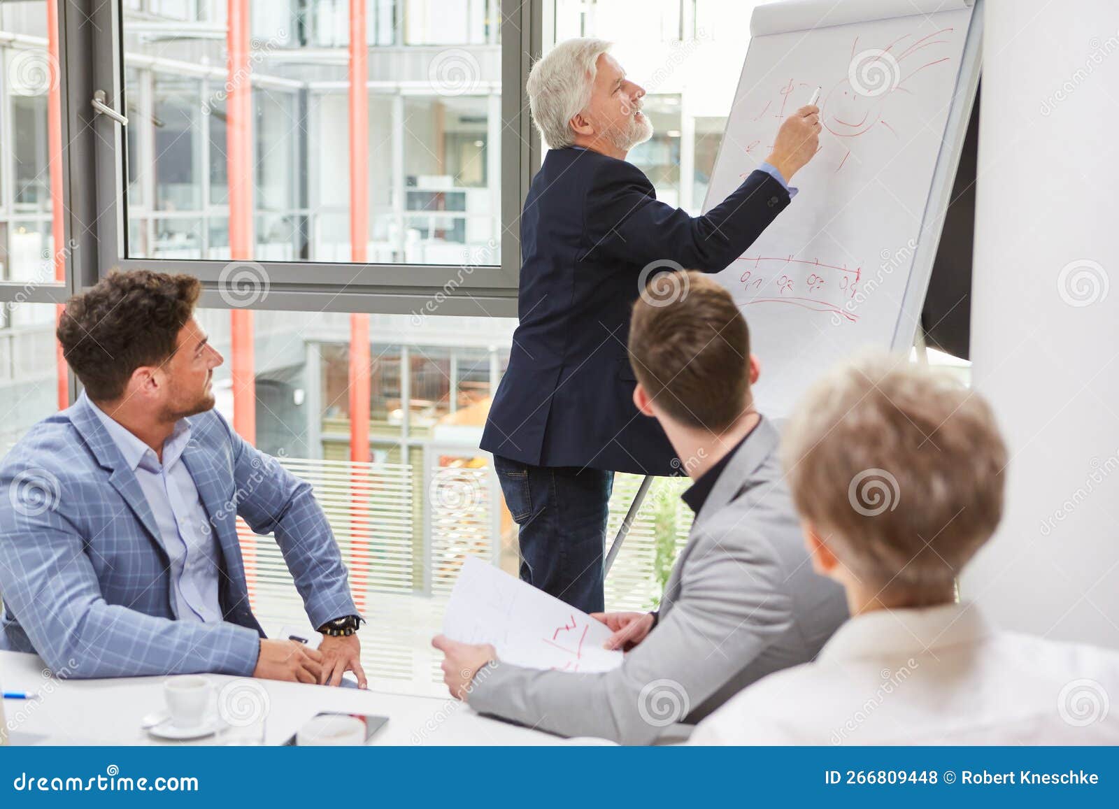 Consultant at Business Workshop on Whiteboard in Front of Team Stock ...
