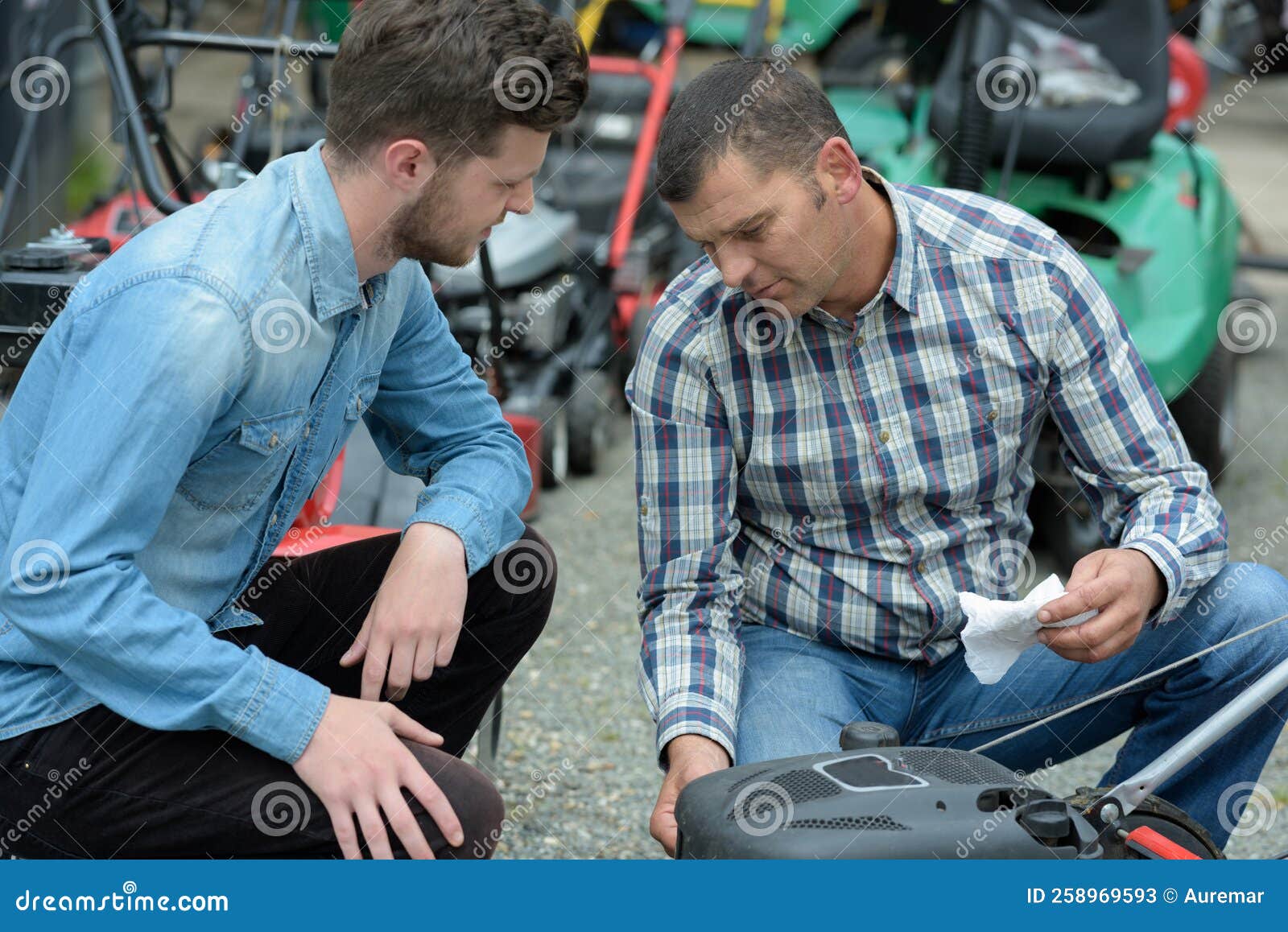 Consultant Shows Customer Lawn Mower in Store Stock Image - Image of ...