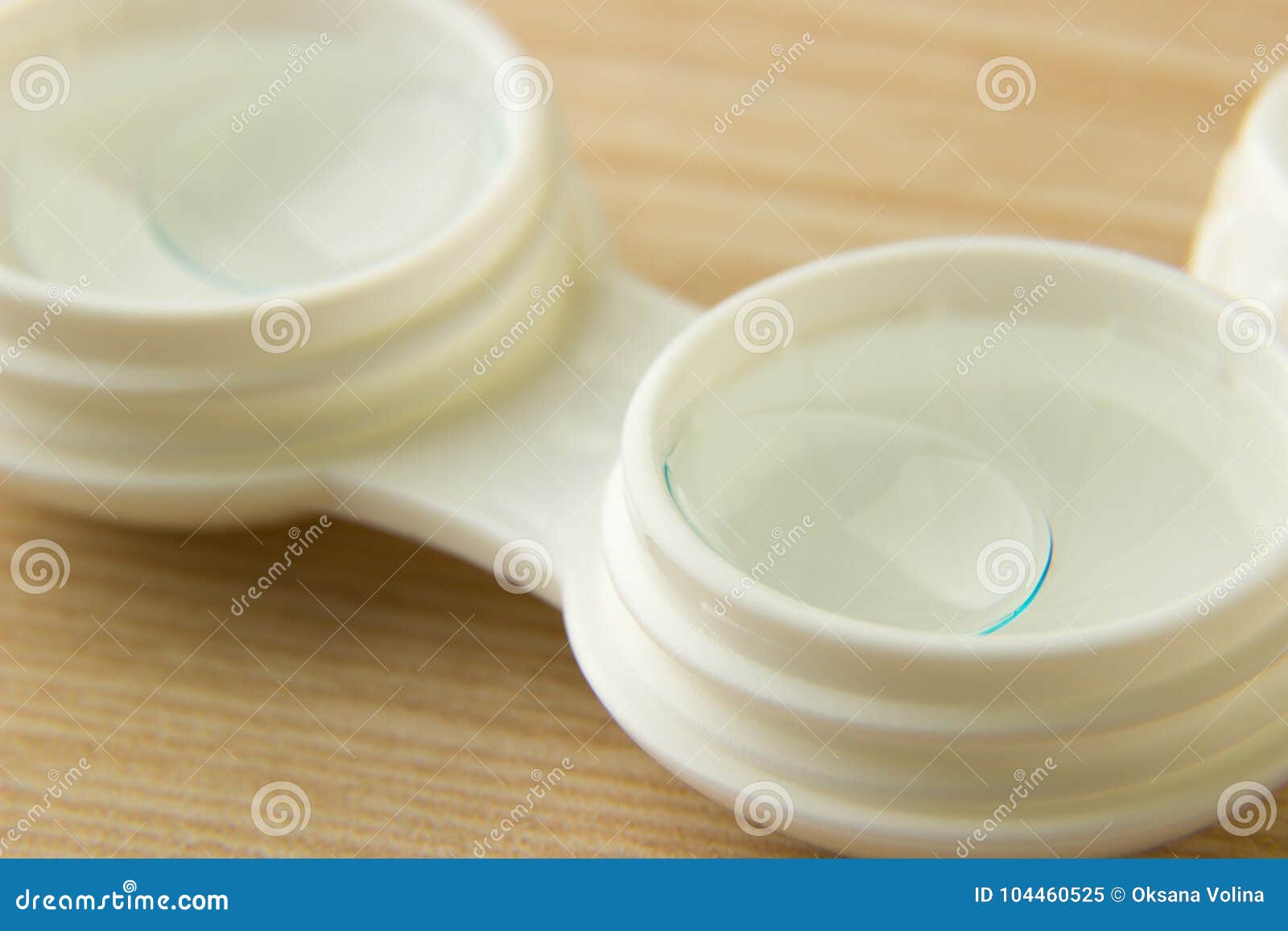 Contact Lenses for the Eyes and a White Container with a Solution on a ...