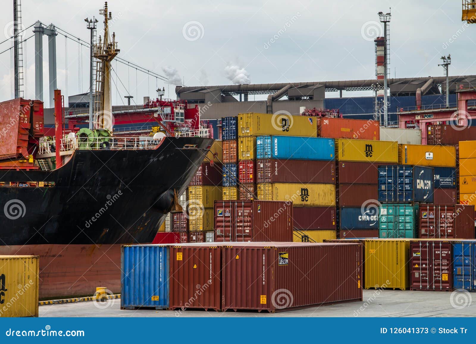 The Container Is Being Lowered From The Ship That Is Approaching The ...