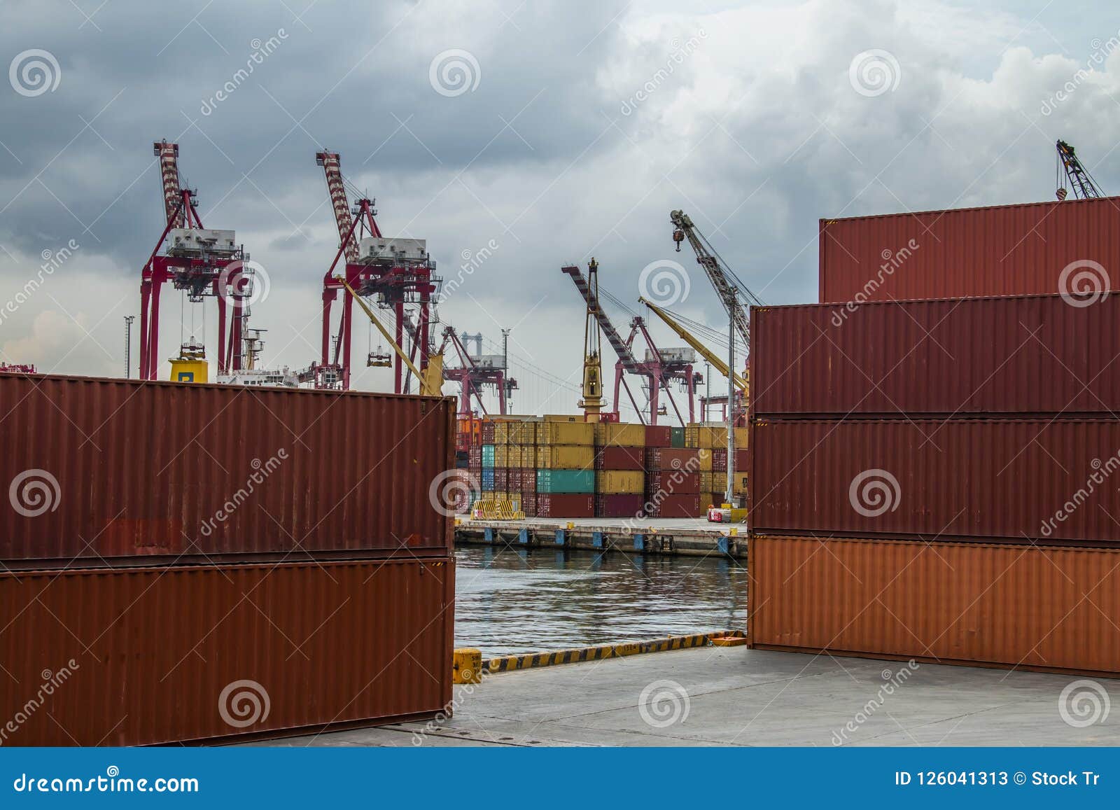 The Container is Being Lowered from the Ship that is Approaching the ...