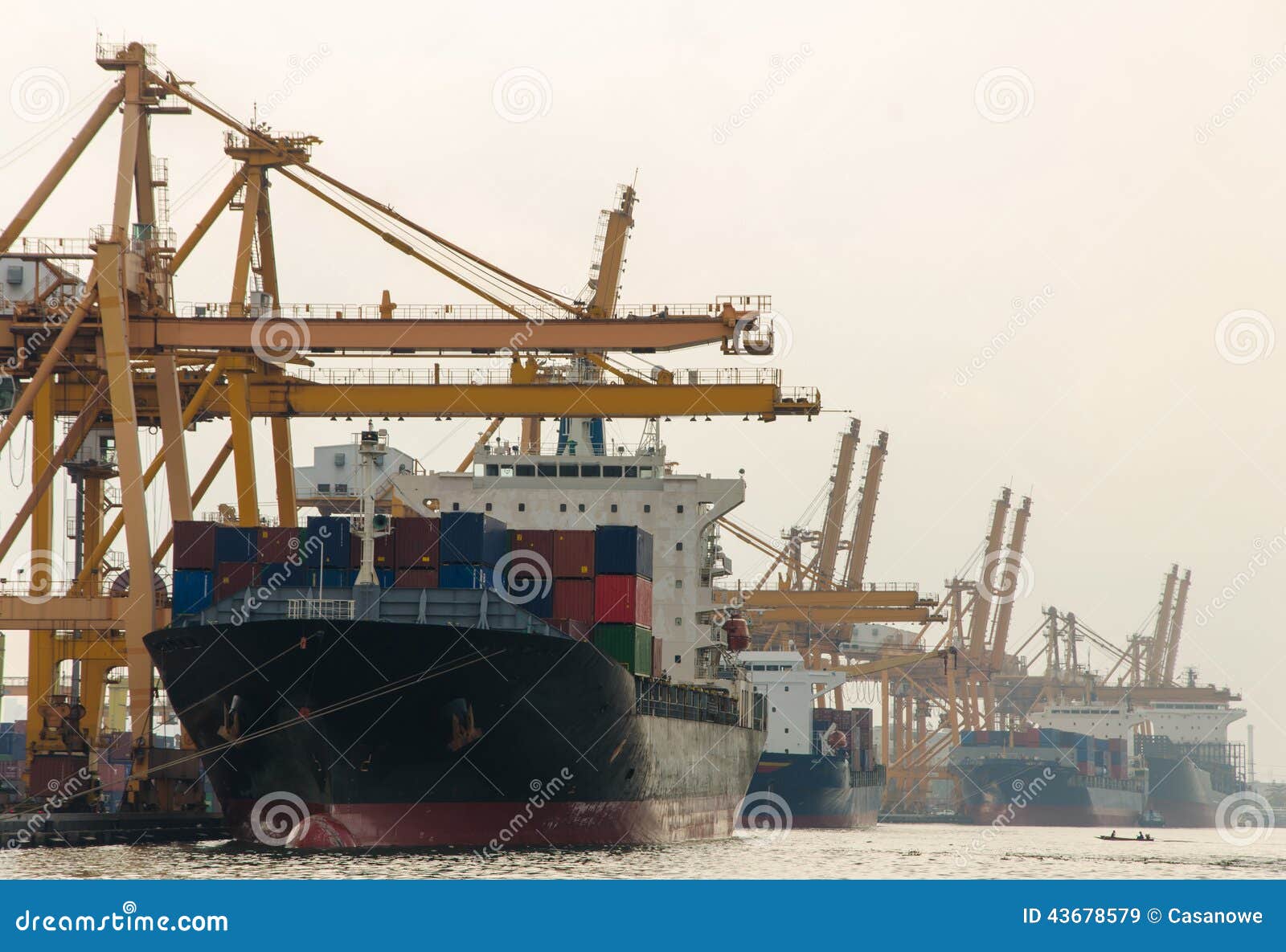Container Cargo Freight Ship with Working Crane Bridge in Shipyard ...