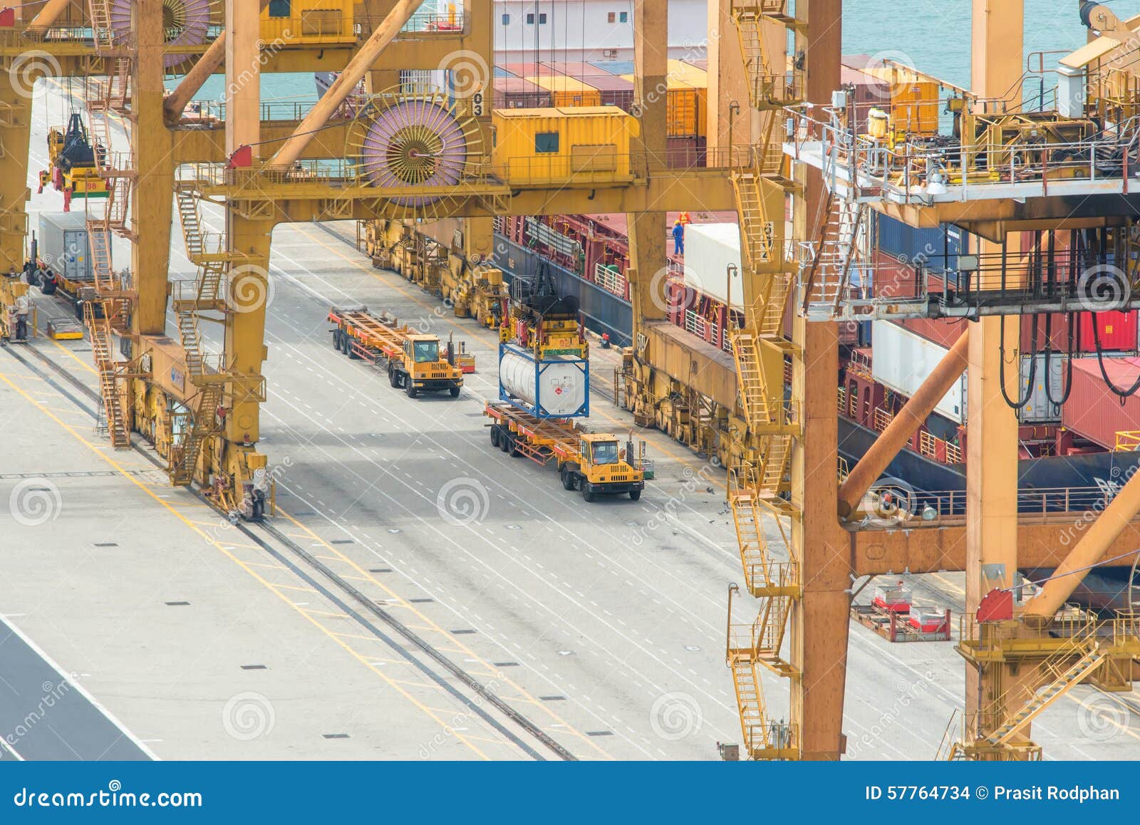 Container Cargo Freight Ship with Working Crane Loading Bridge I Stock ...