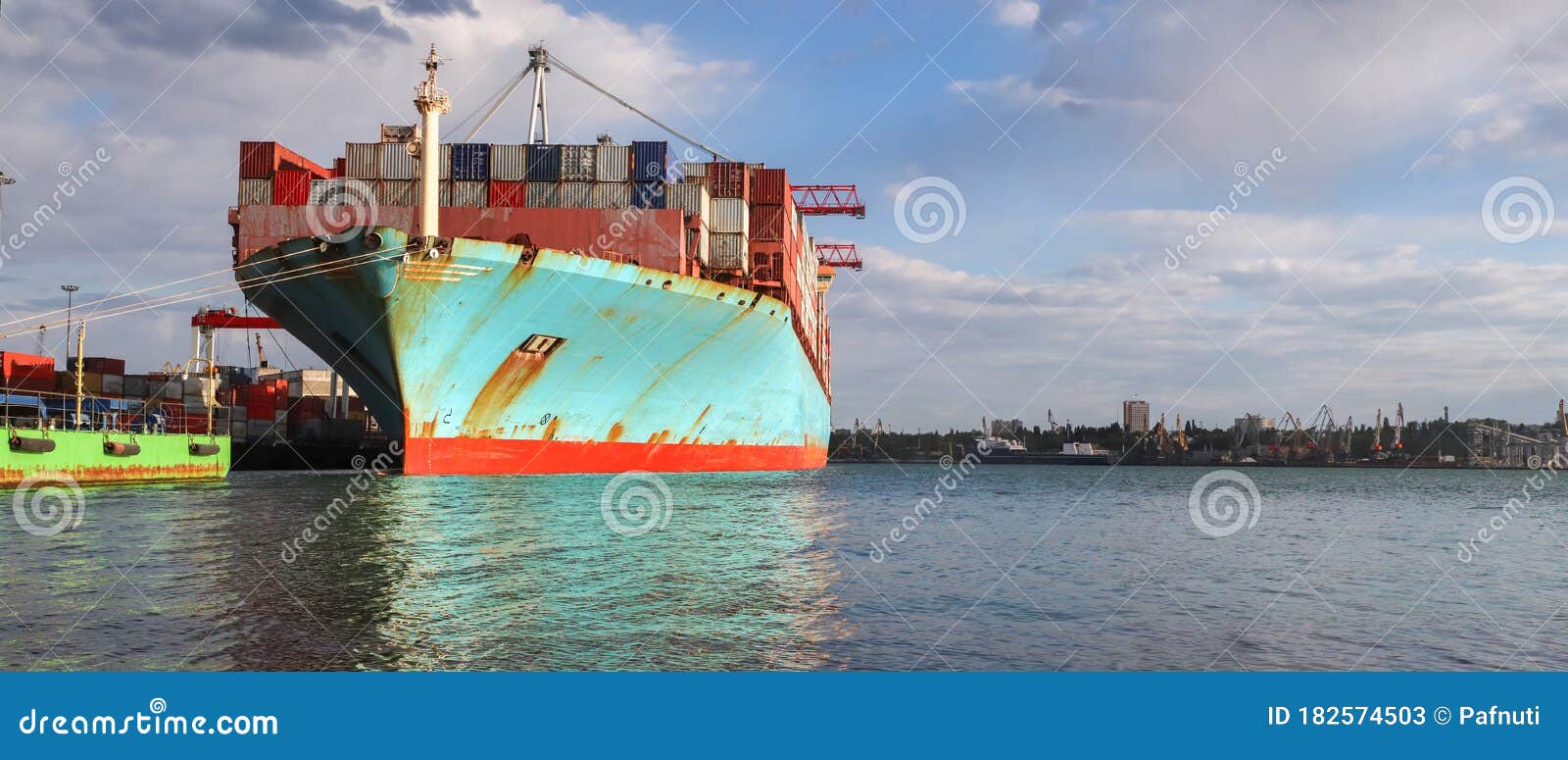 Container Cargo Ship Load in the Seaport. Logistics and Transportation ...