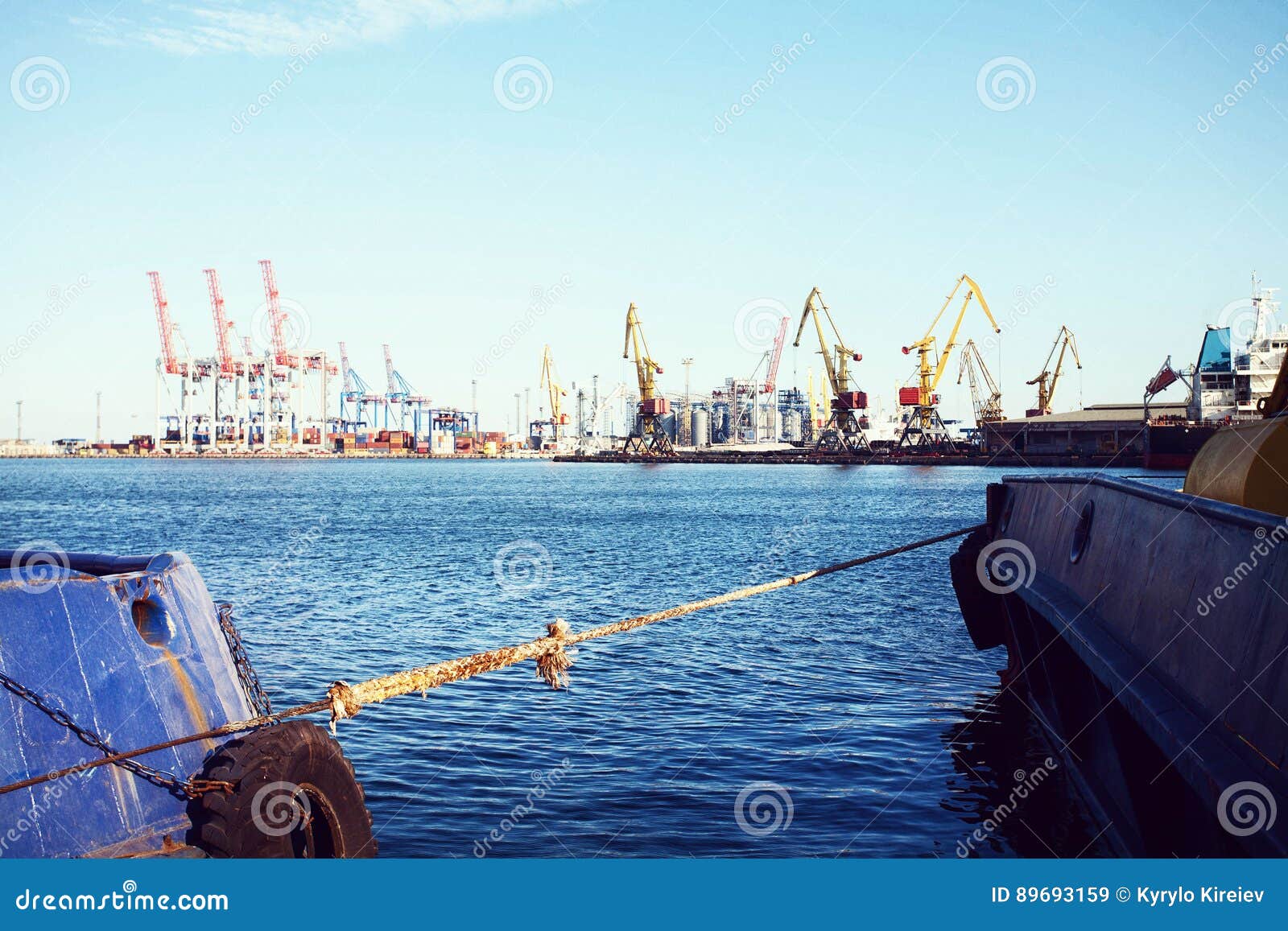 Container Cargo Ship with Working Crane Bridge in Shipyard Background ...
