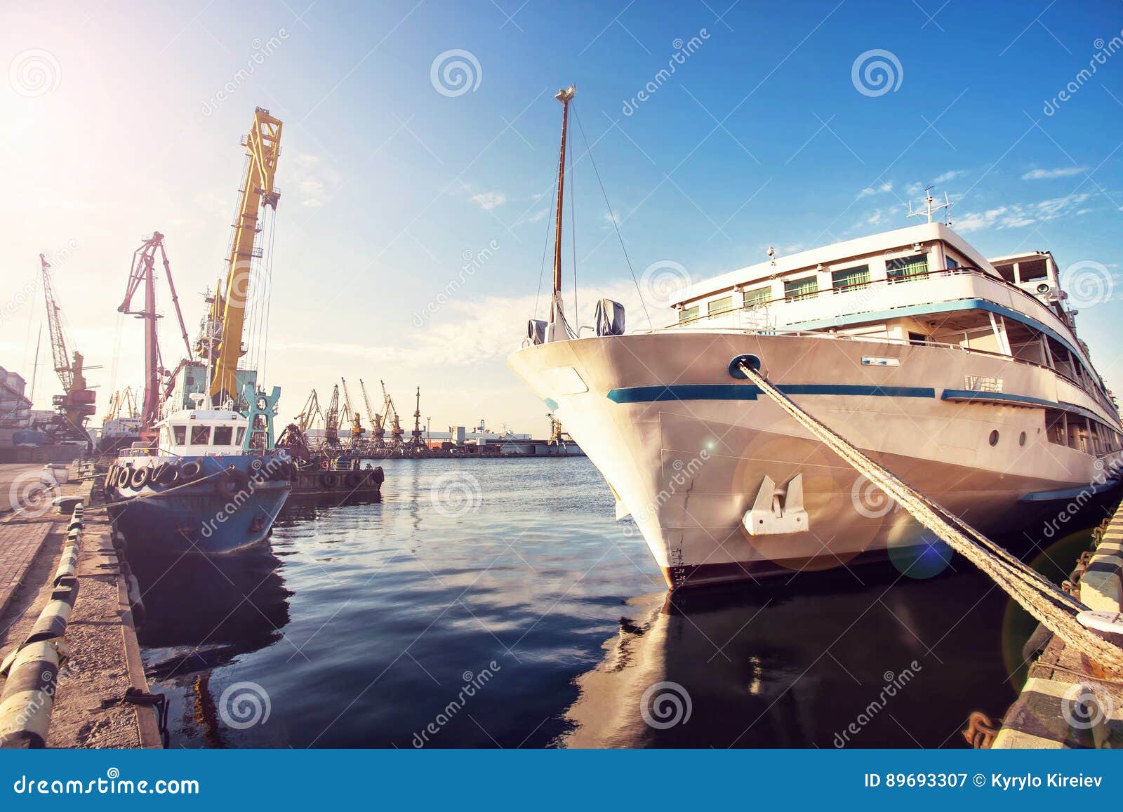 Container Cargo Ship with Working Crane Bridge in Shipyard Background ...