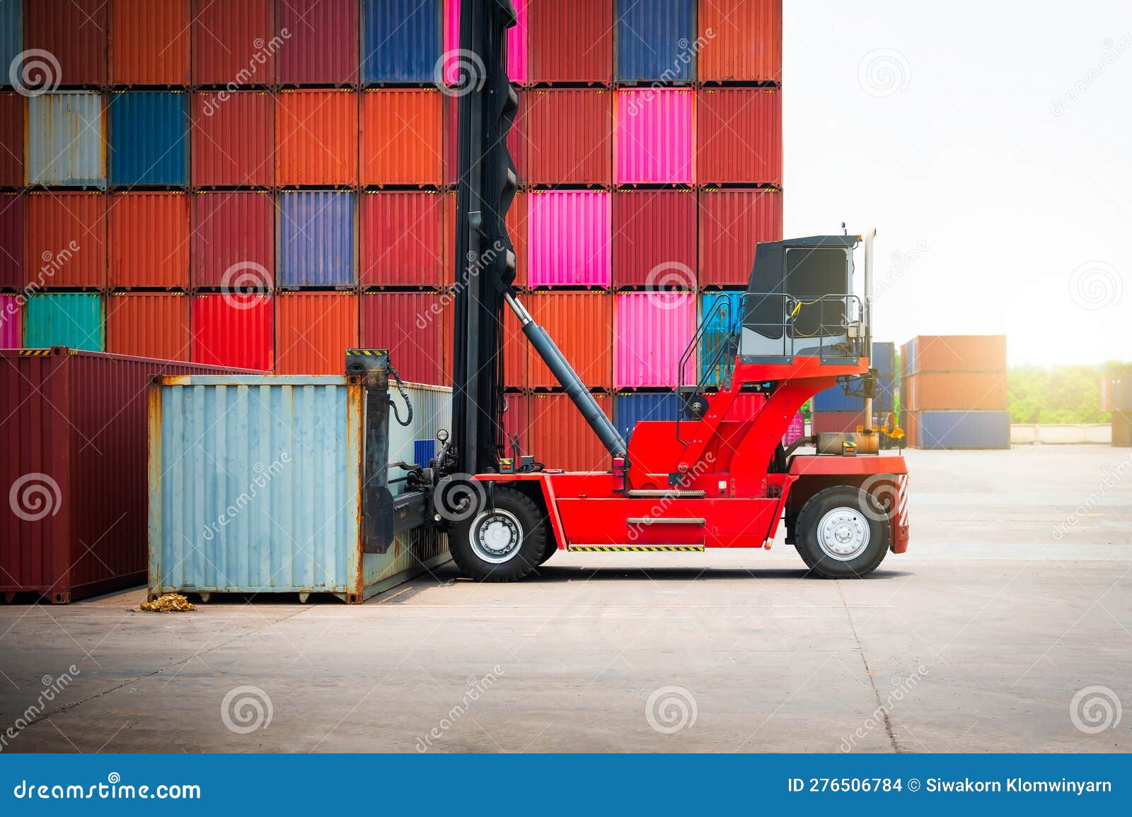 Container Crane Tractor Lifting Up Stacking Cargo Container. Handling ...